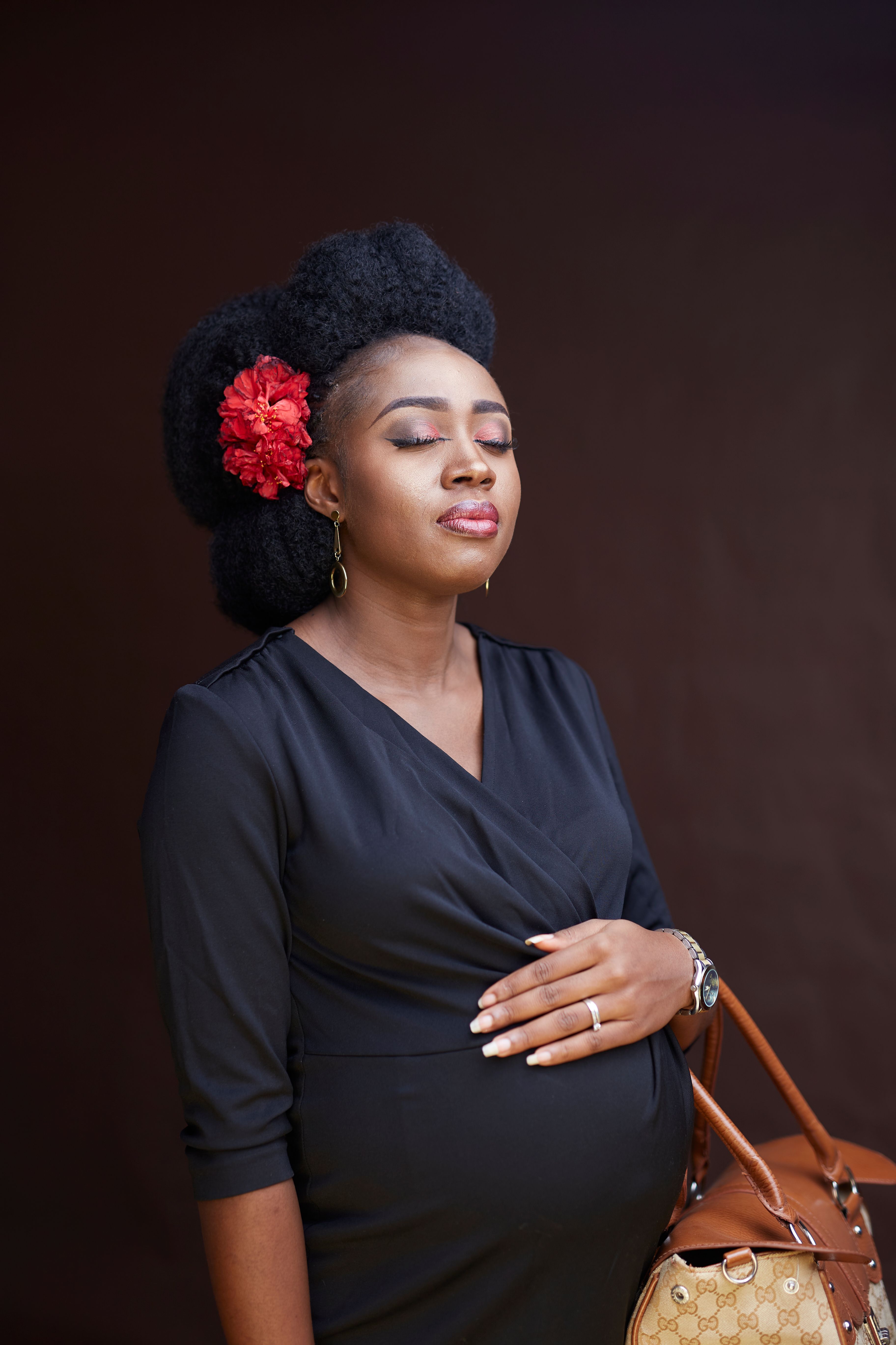 Pregnant Woman in Purple Dress Holding Her Tummy · Free Stock Photo
