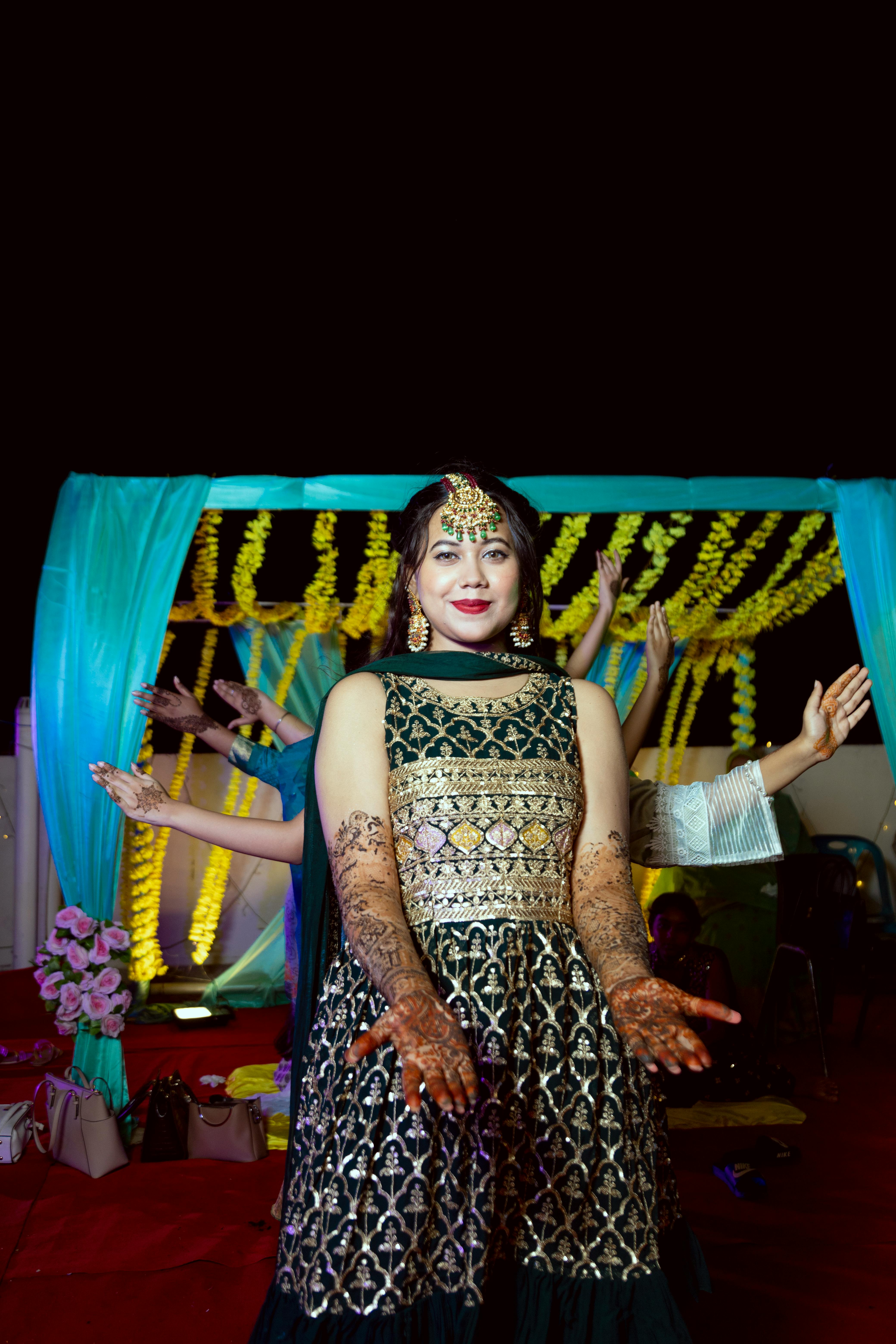 Women Setting Up a Table for a Traditional Celebration · Free Stock Photo