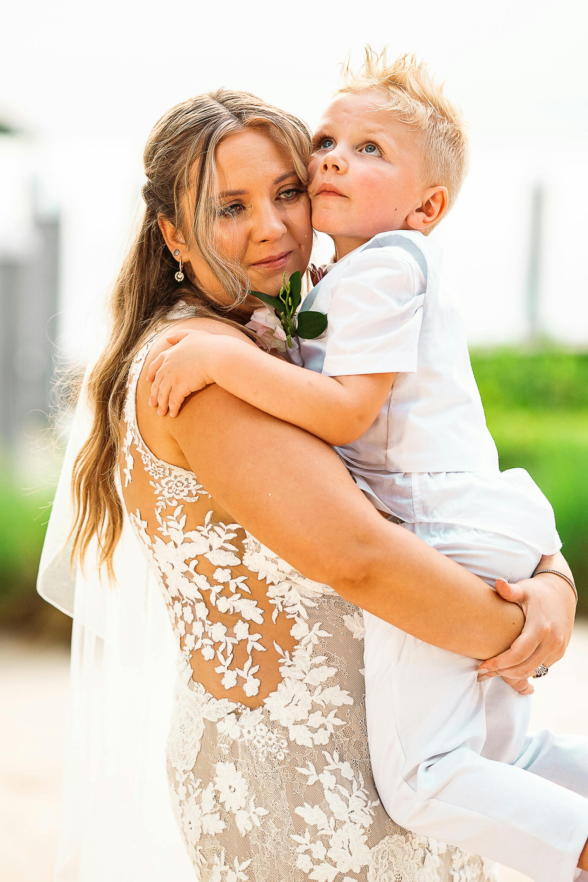 A Child Hugging Green and Yellow Book · Free Stock Photo