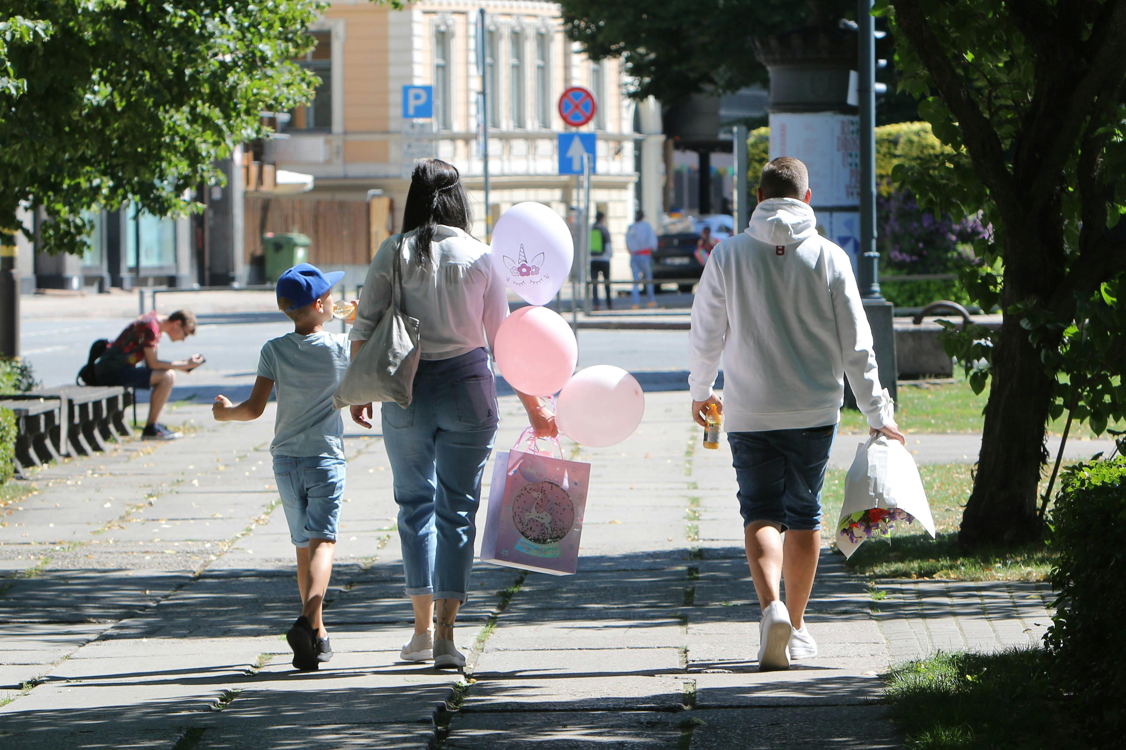 Back View of Three People Walking on the Street · Free Stock Photo