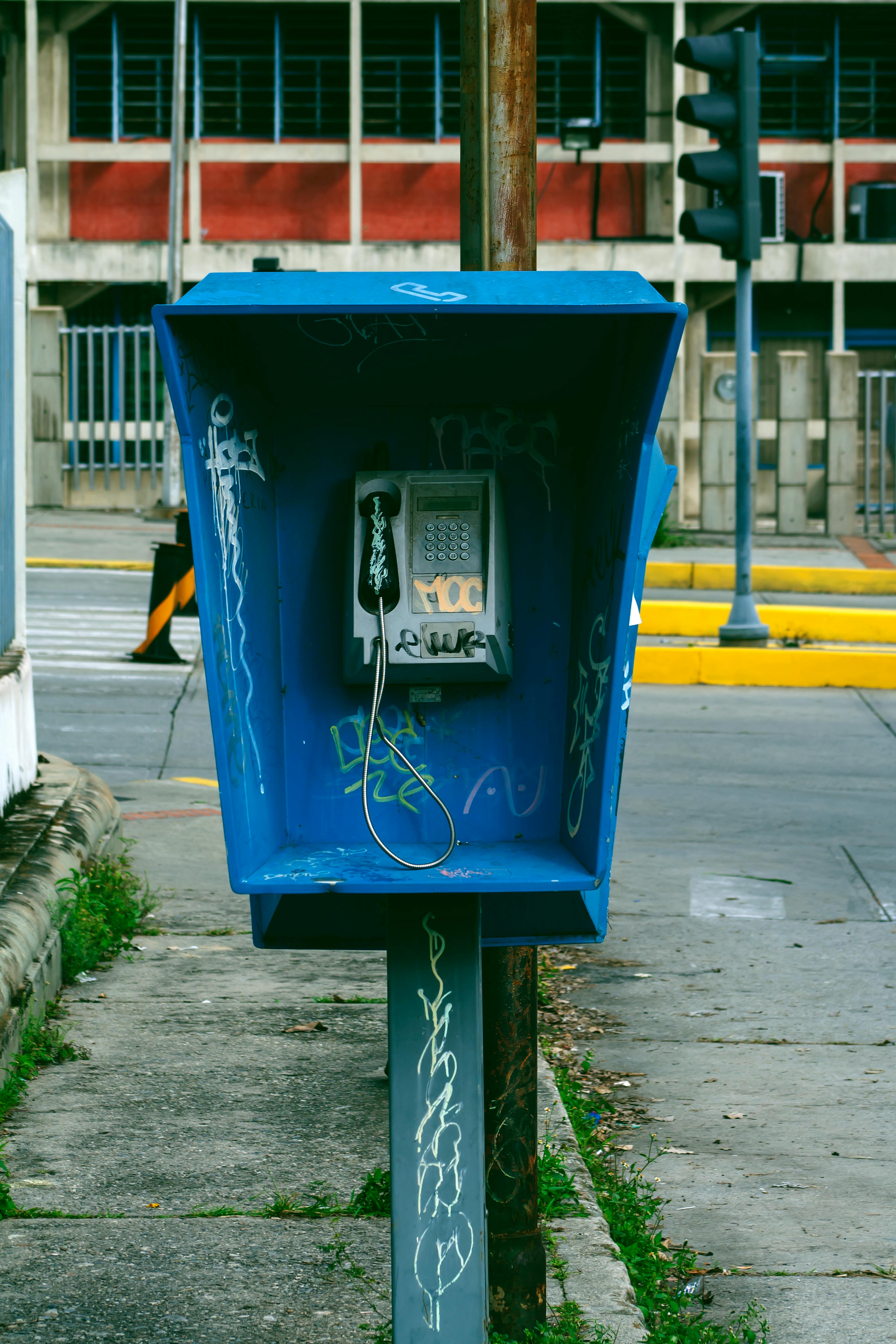 A Blue Payphone Booth at the Street · Free Stock Photo