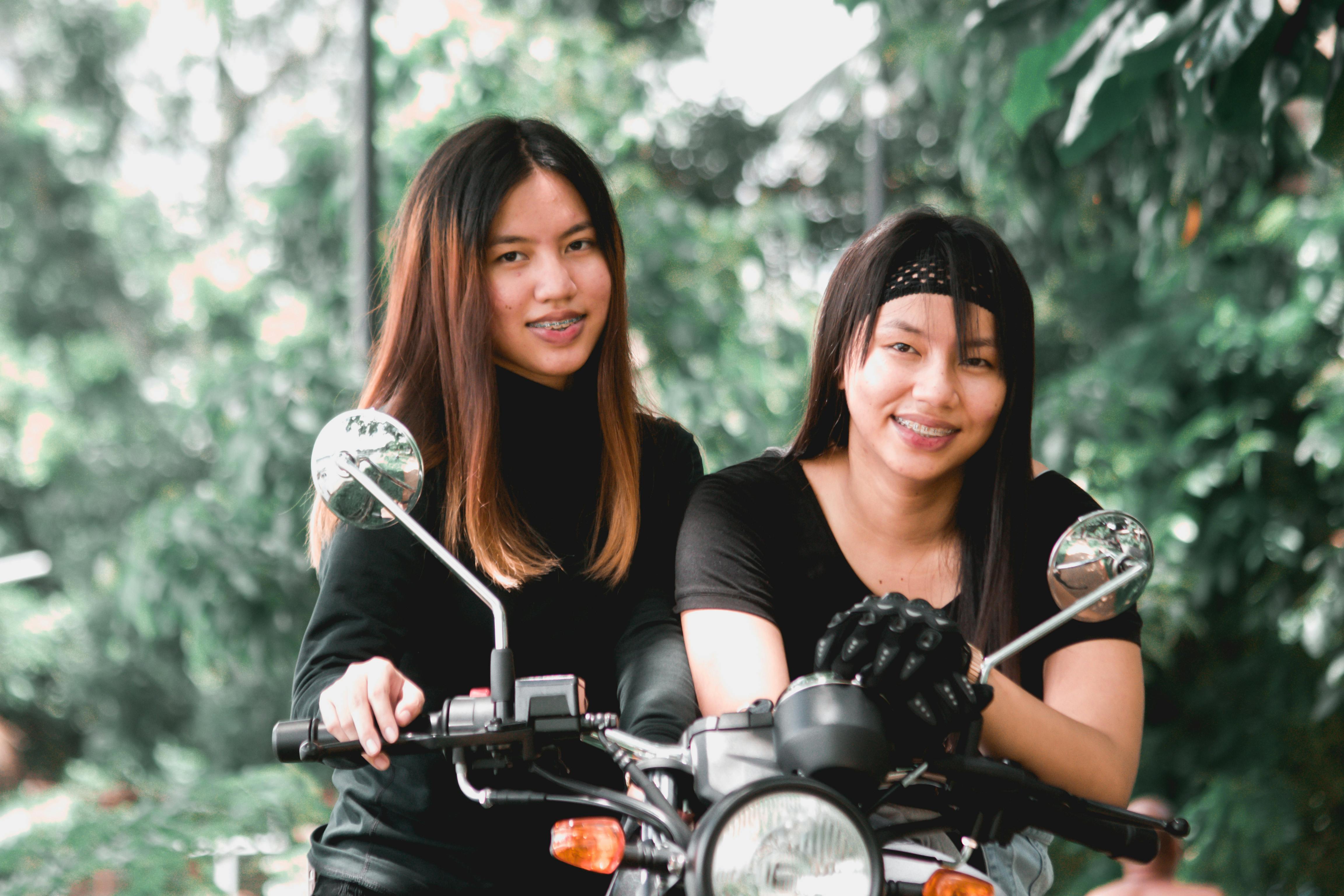 Beautiful Women on a Motorcycle · Free Stock Photo