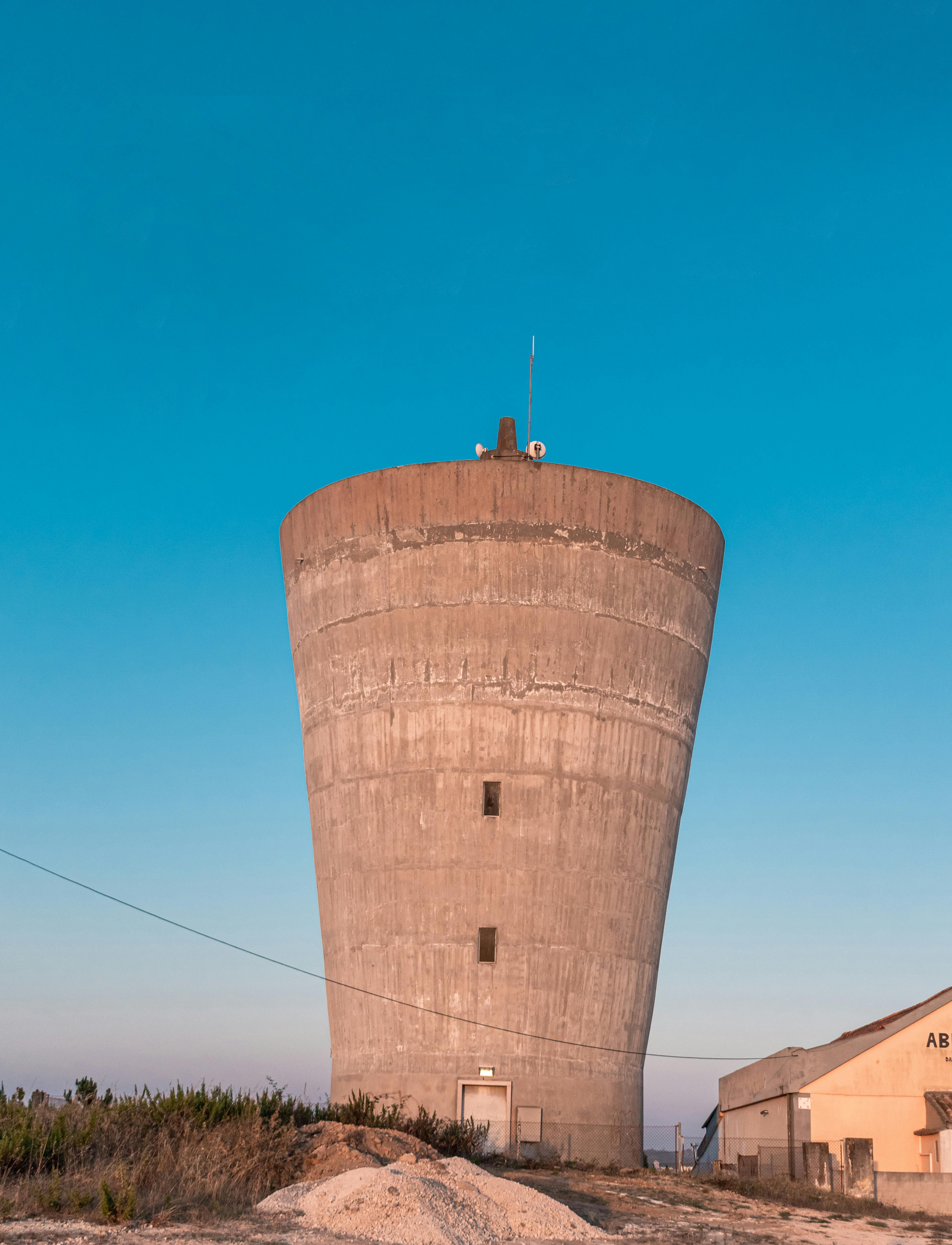 A Photo of Abandoned Water Tank Tower on Farmland · Free Stock Photo