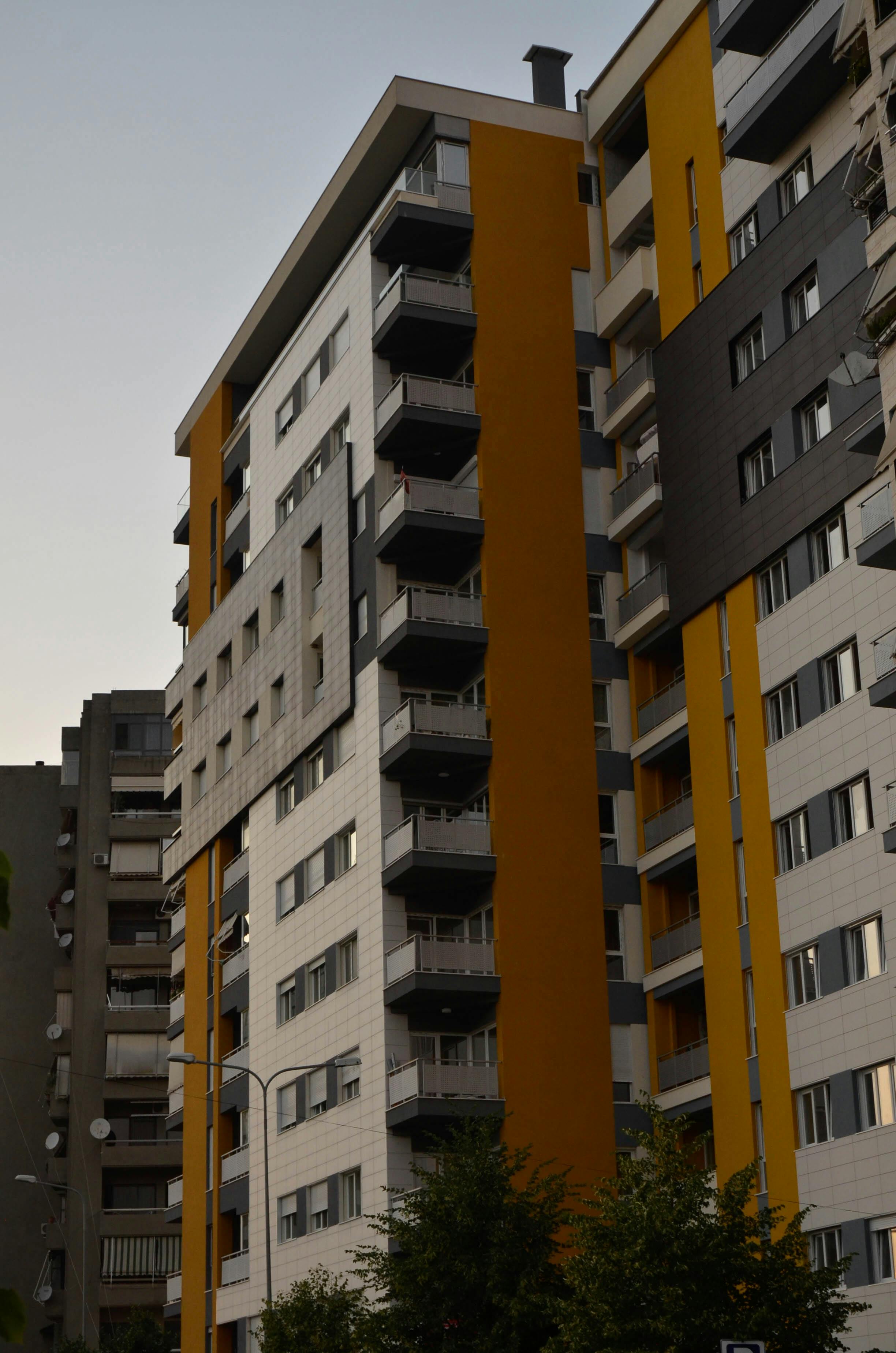 Black and Yellow Building Under White Sky · Free Stock Photo