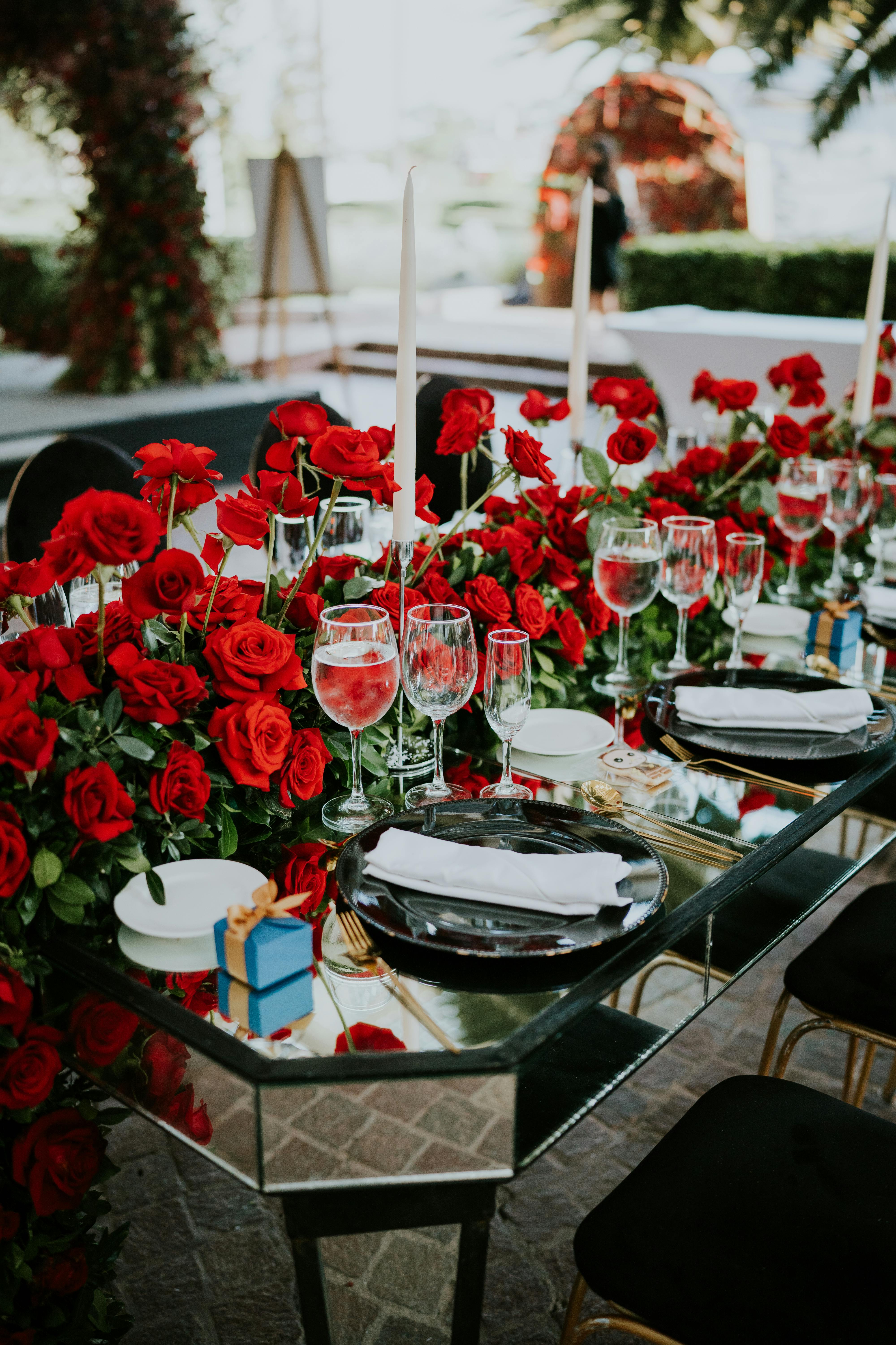 Red Roses on Table With Plates and Bowls · Free Stock Photo