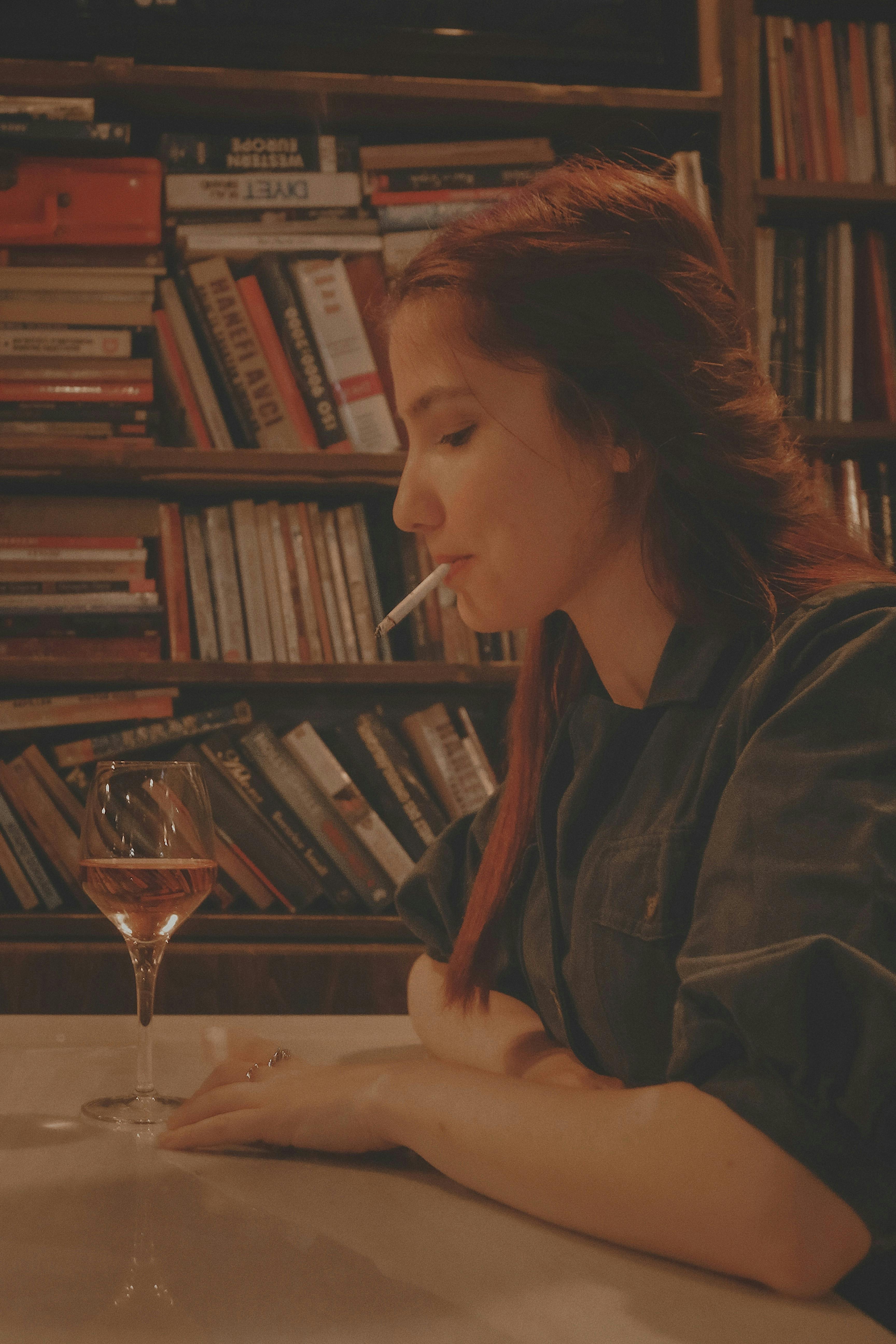 Back View of a Person Sitting Smoking · Free Stock Photo