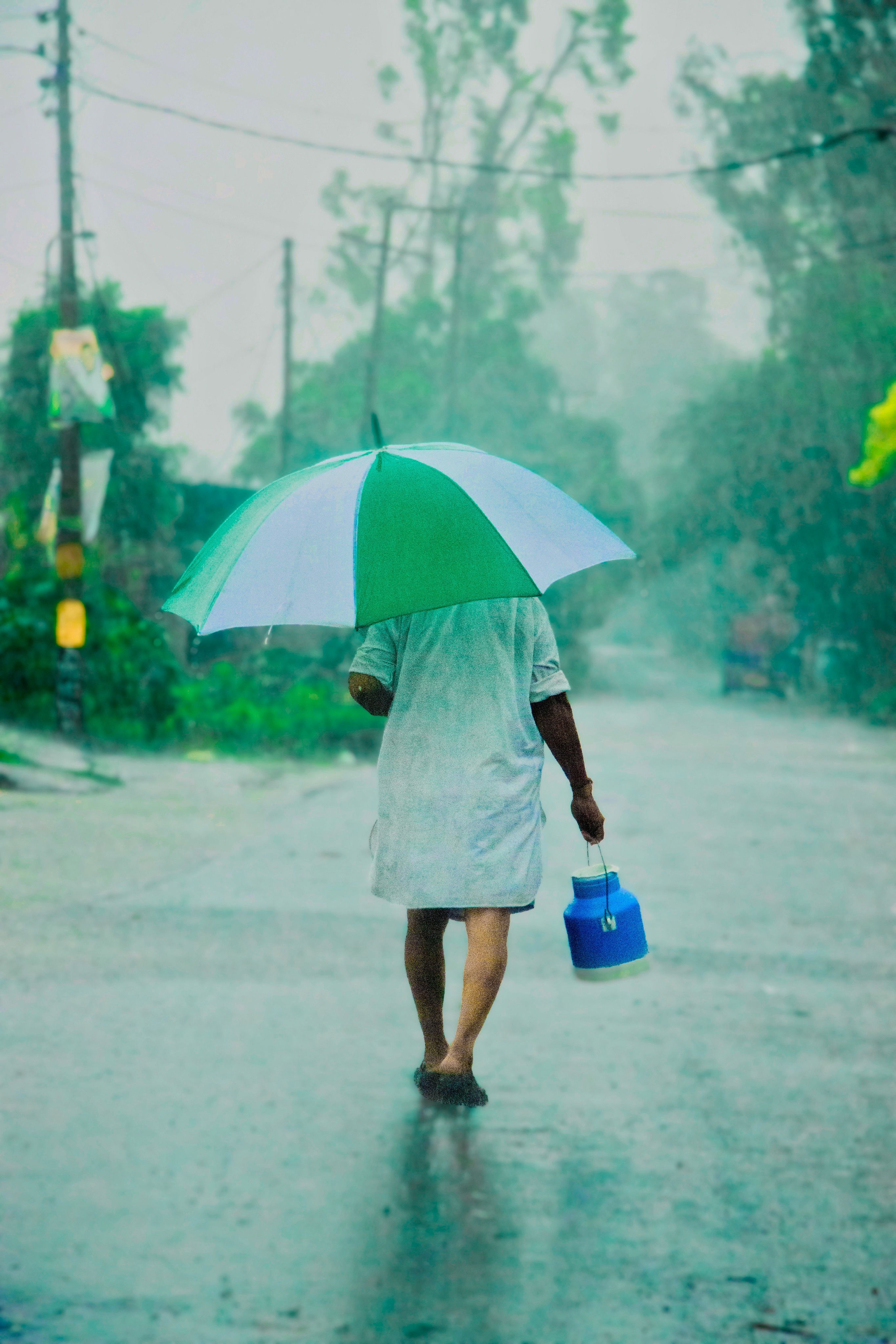 Smoking Man Walking in Rain with Umbrella · Free Stock Photo