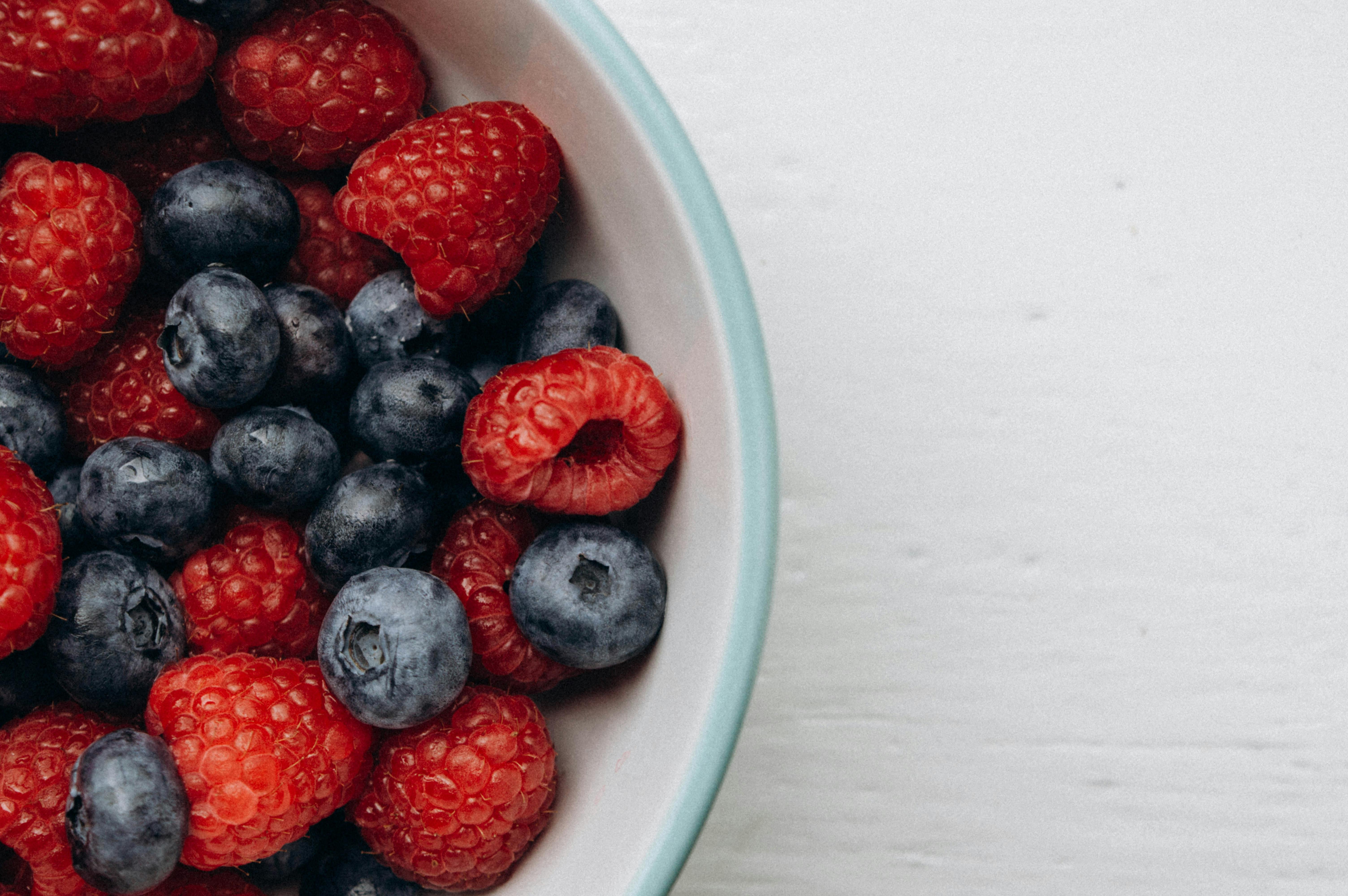 Raspberry and Blueberry in White Ceramic Bowl · Free Stock Photo