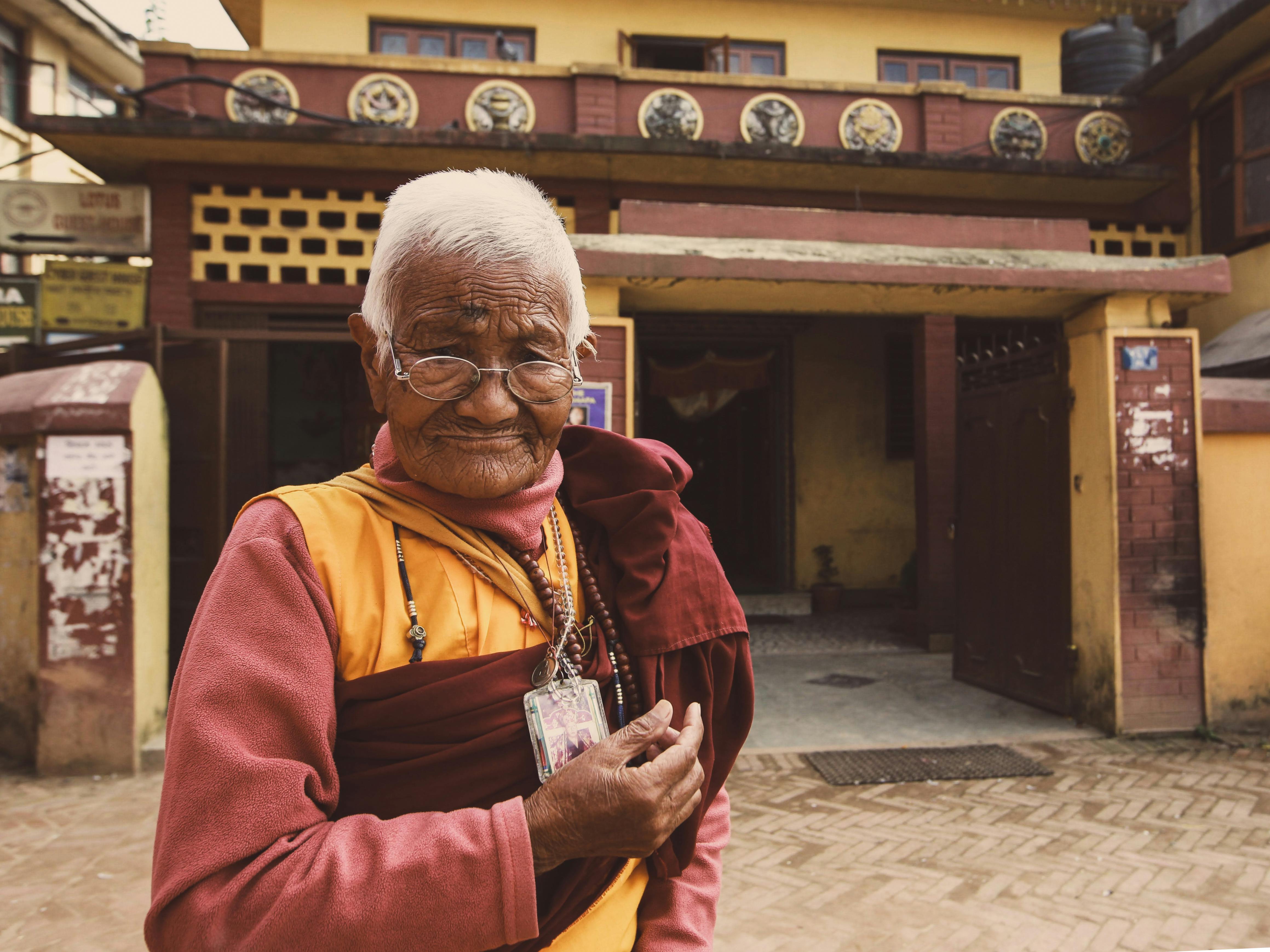 Selective Focus Photography of Monk during Meditation · Free Stock Photo