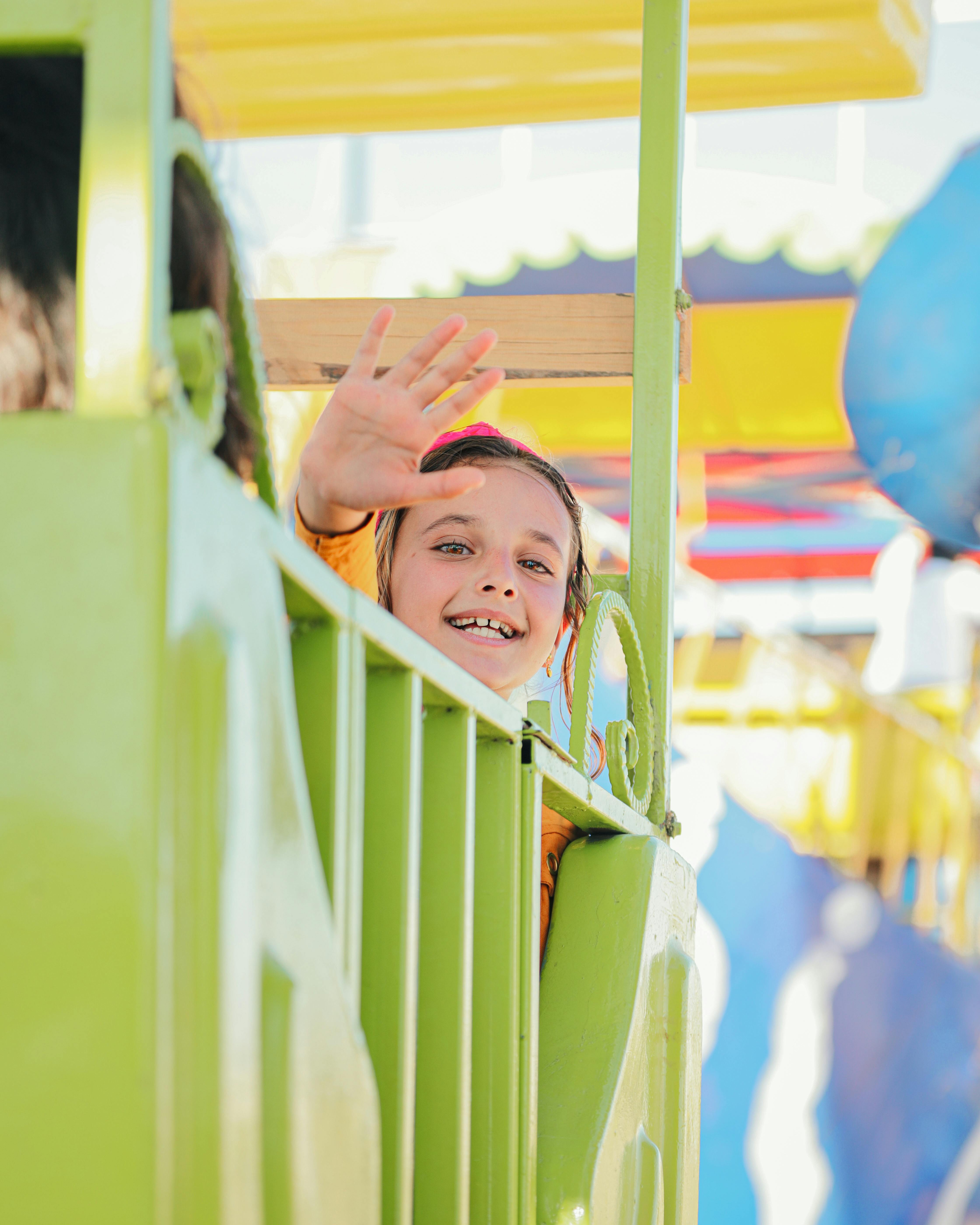Photo of a Kid Waving · Free Stock Photo