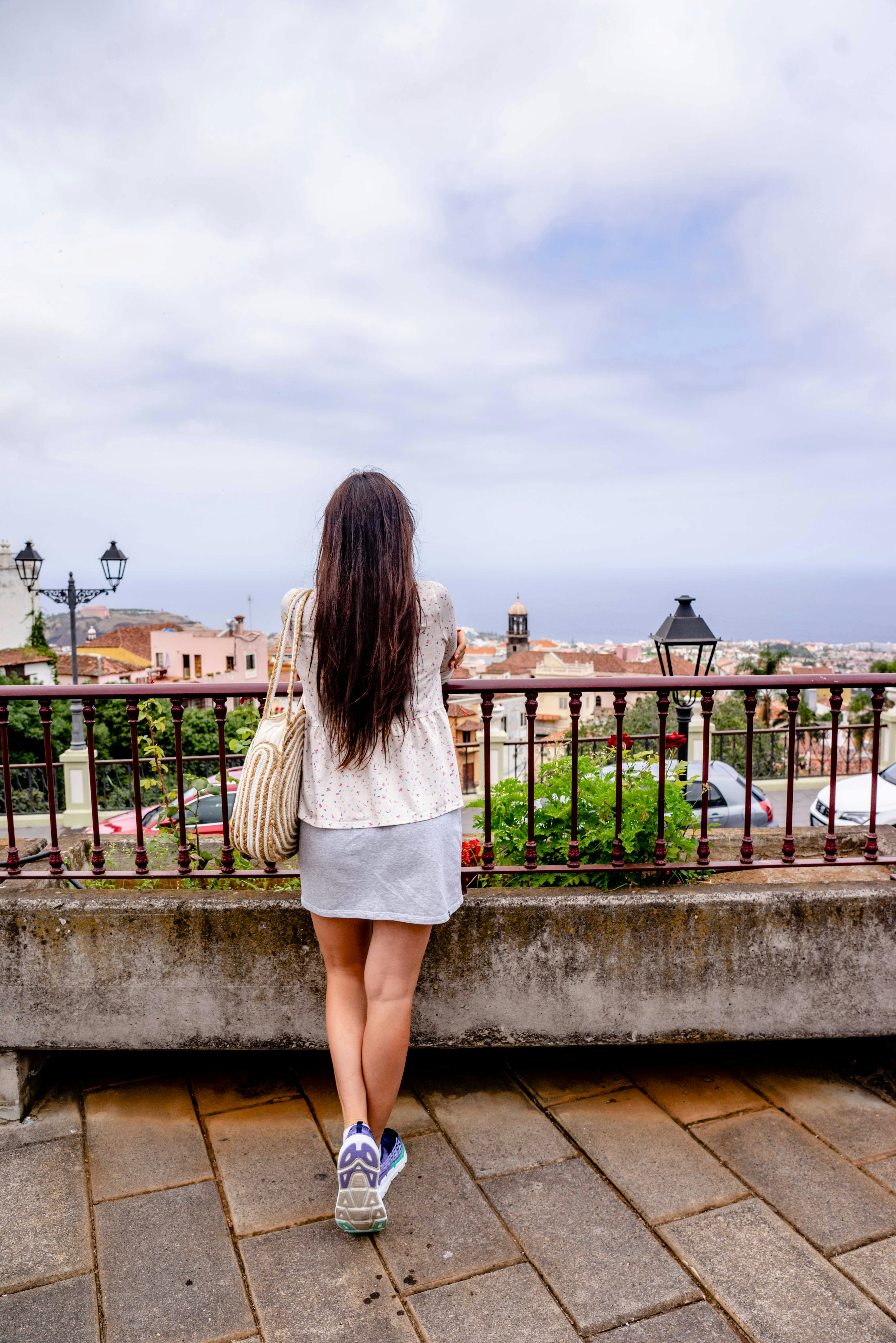 Woman Leaning on a Railing · Free Stock Photo