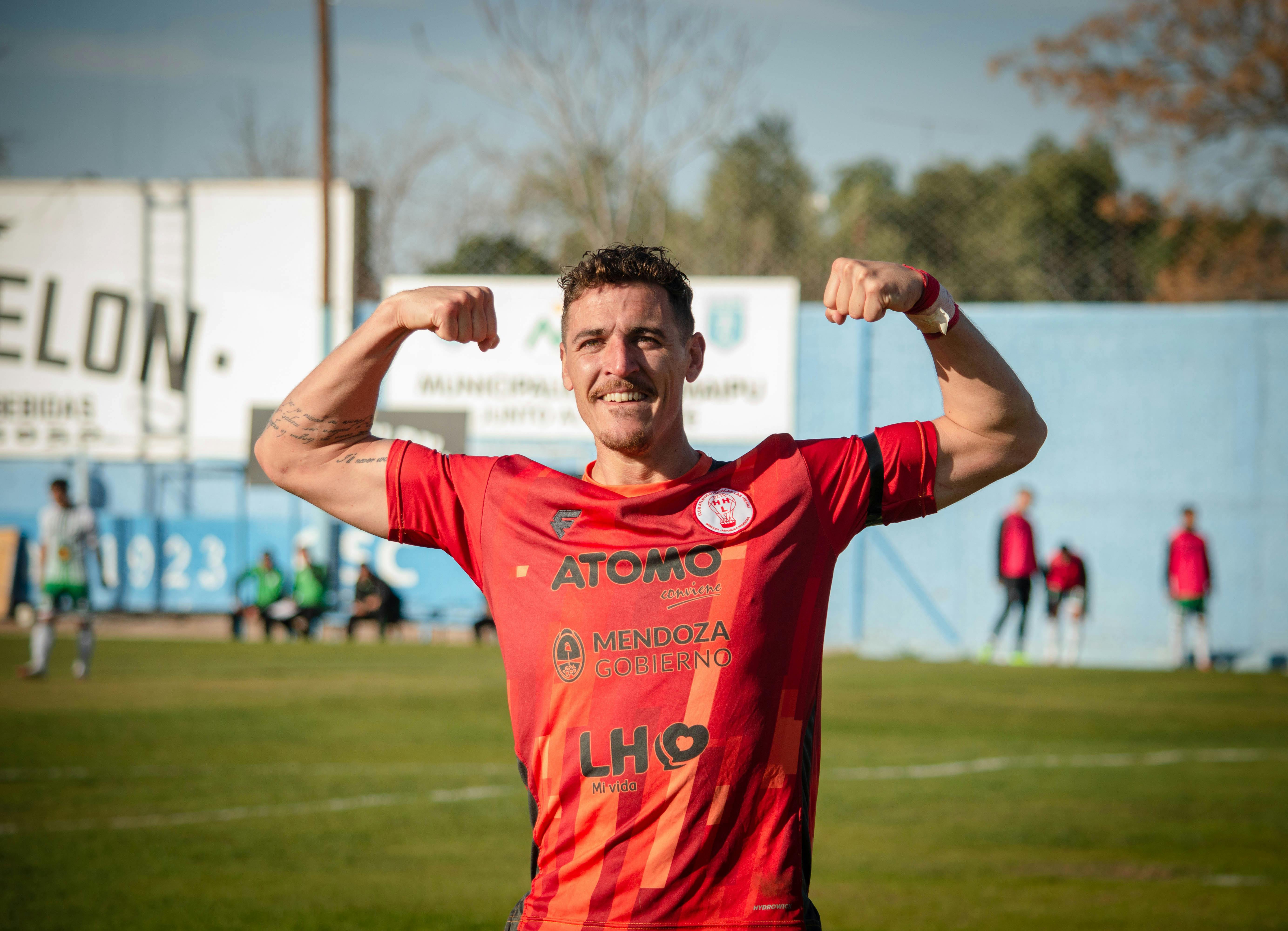 A Man Flexing his Muscle · Free Stock Photo