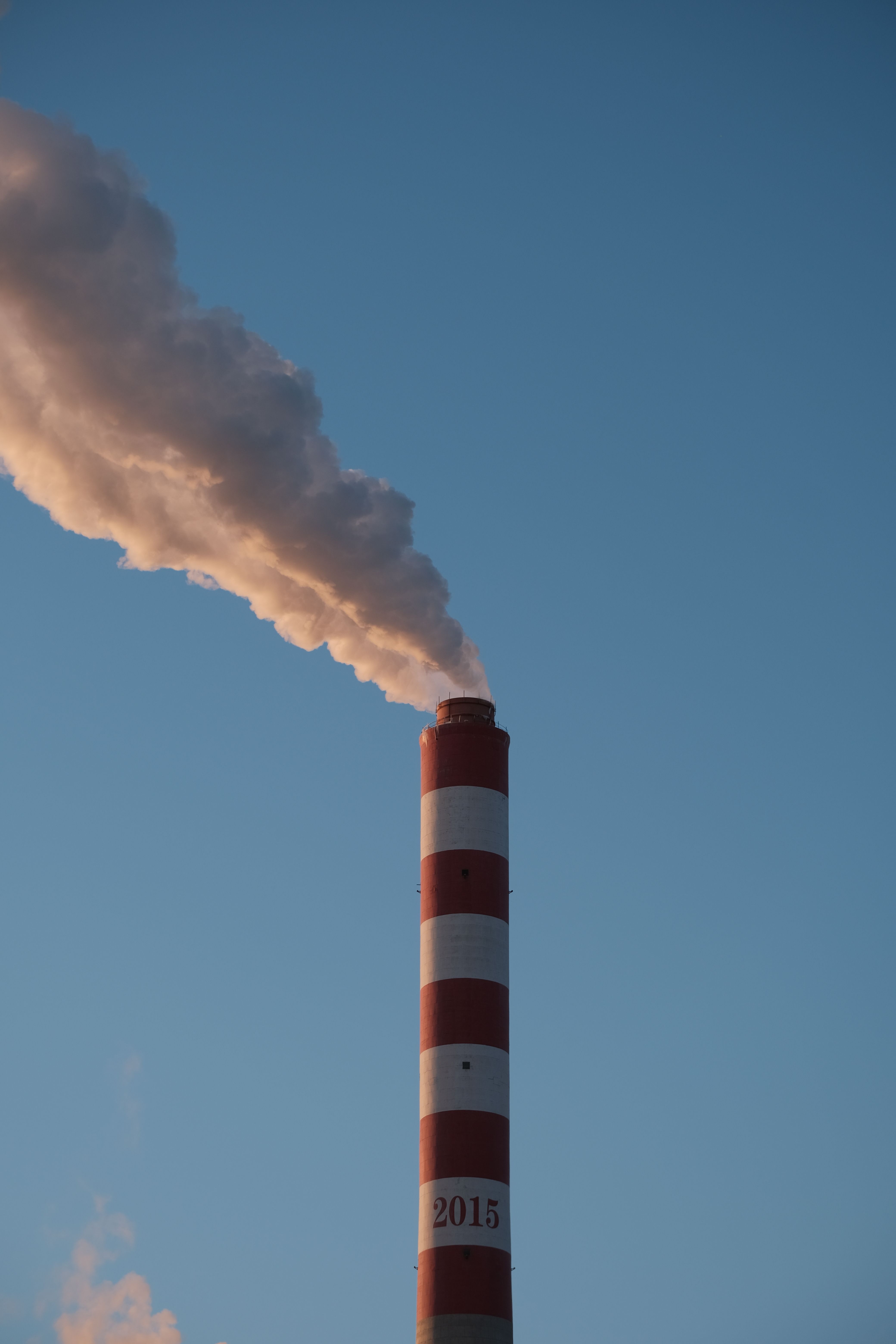 Smoke Stacks Against Blue Sky · Free Stock Photo