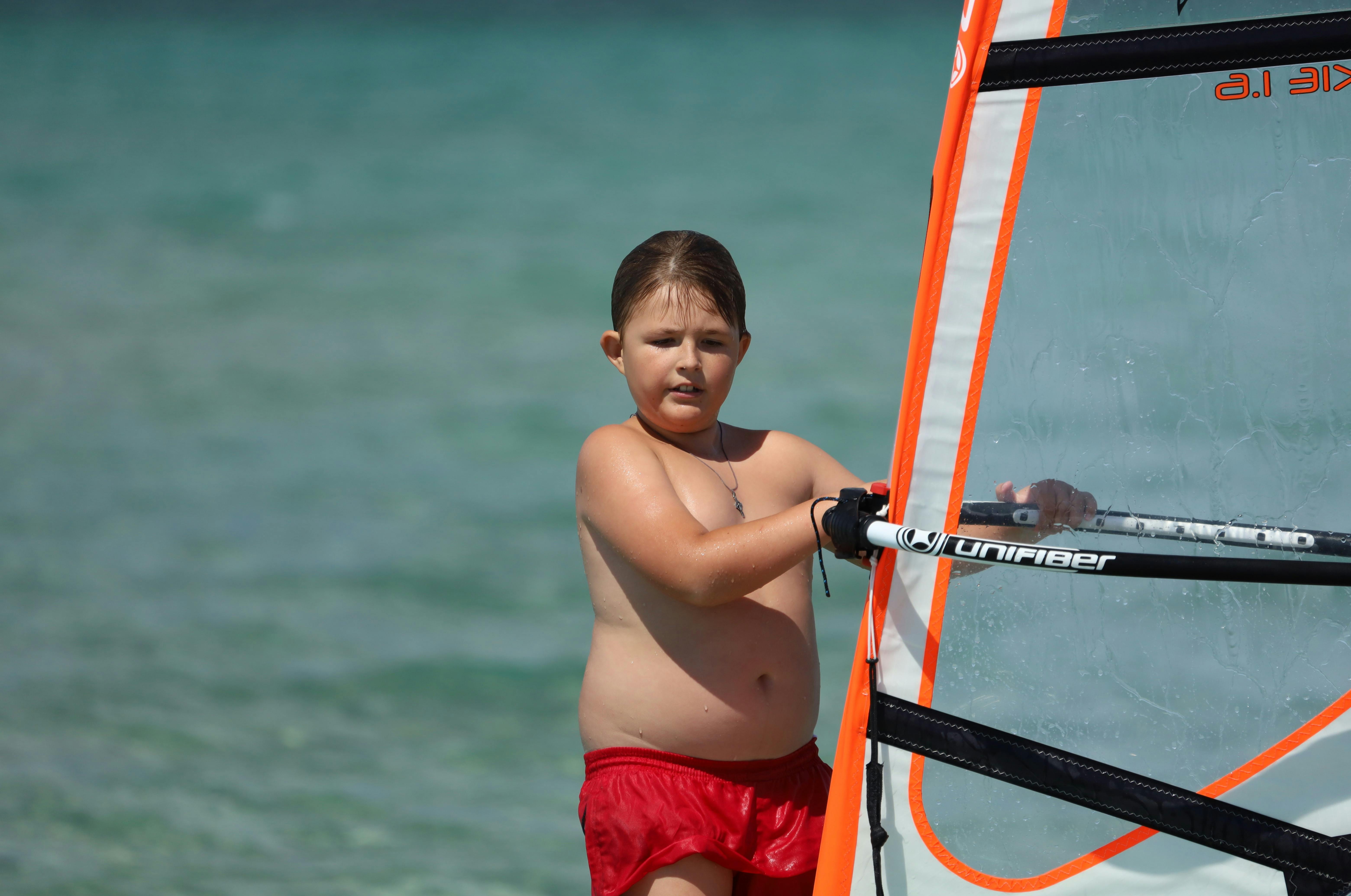 A Boy Doing Sailboarding · Free Stock Photo