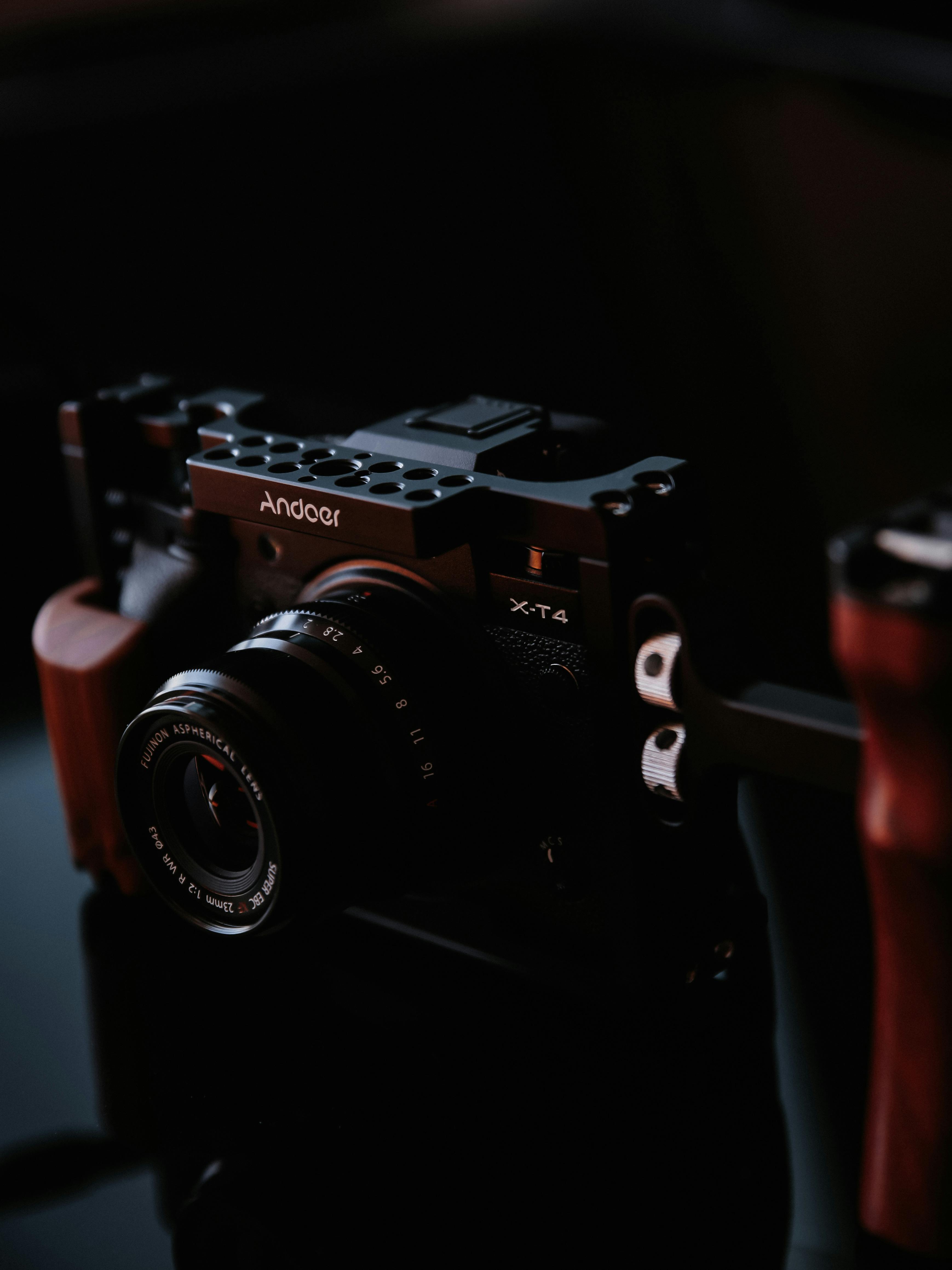 A Brown and Black Camera in Dark Background · Free Stock Photo