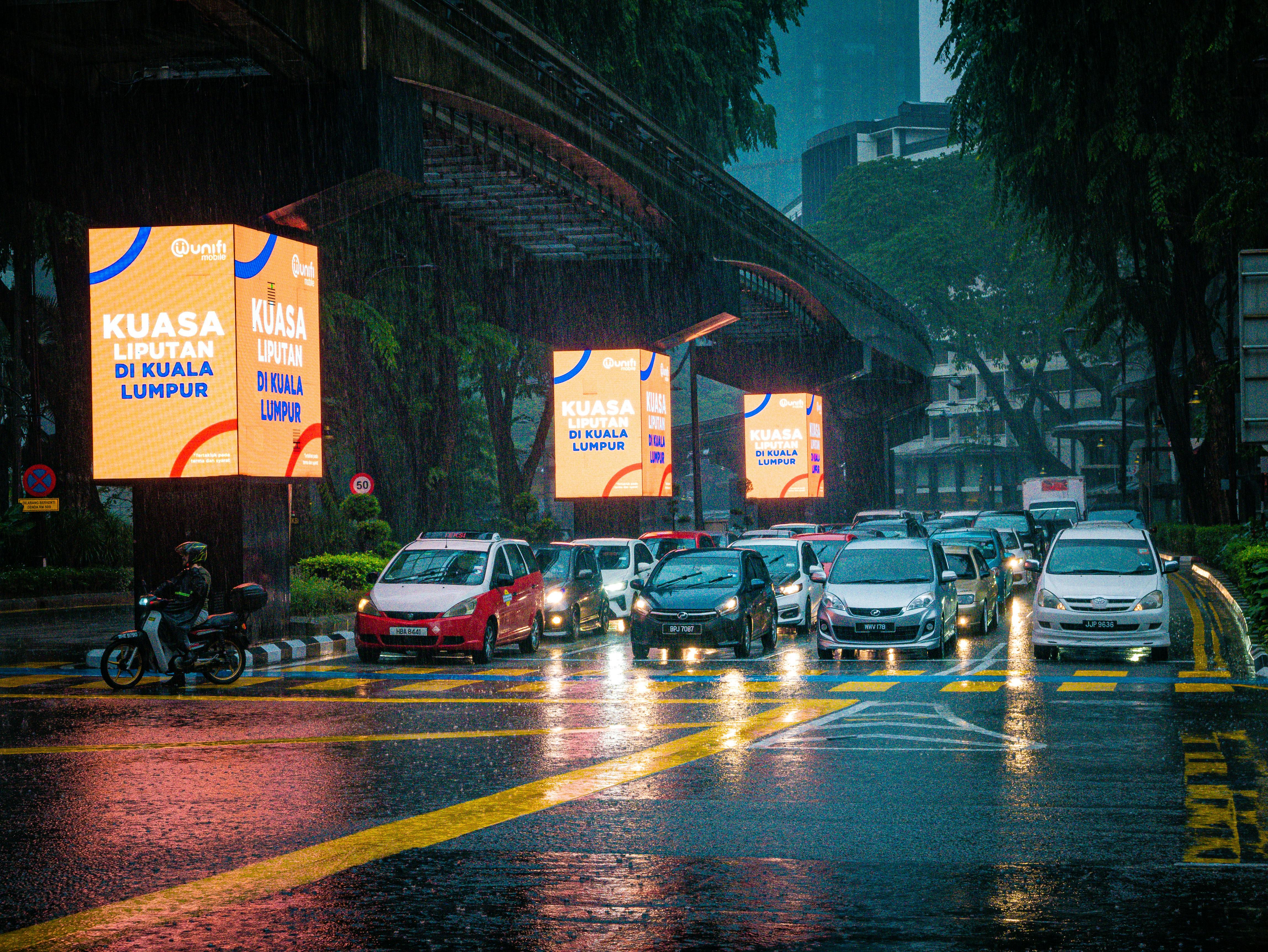 Cars on a Road Under the Rain · Free Stock Photo