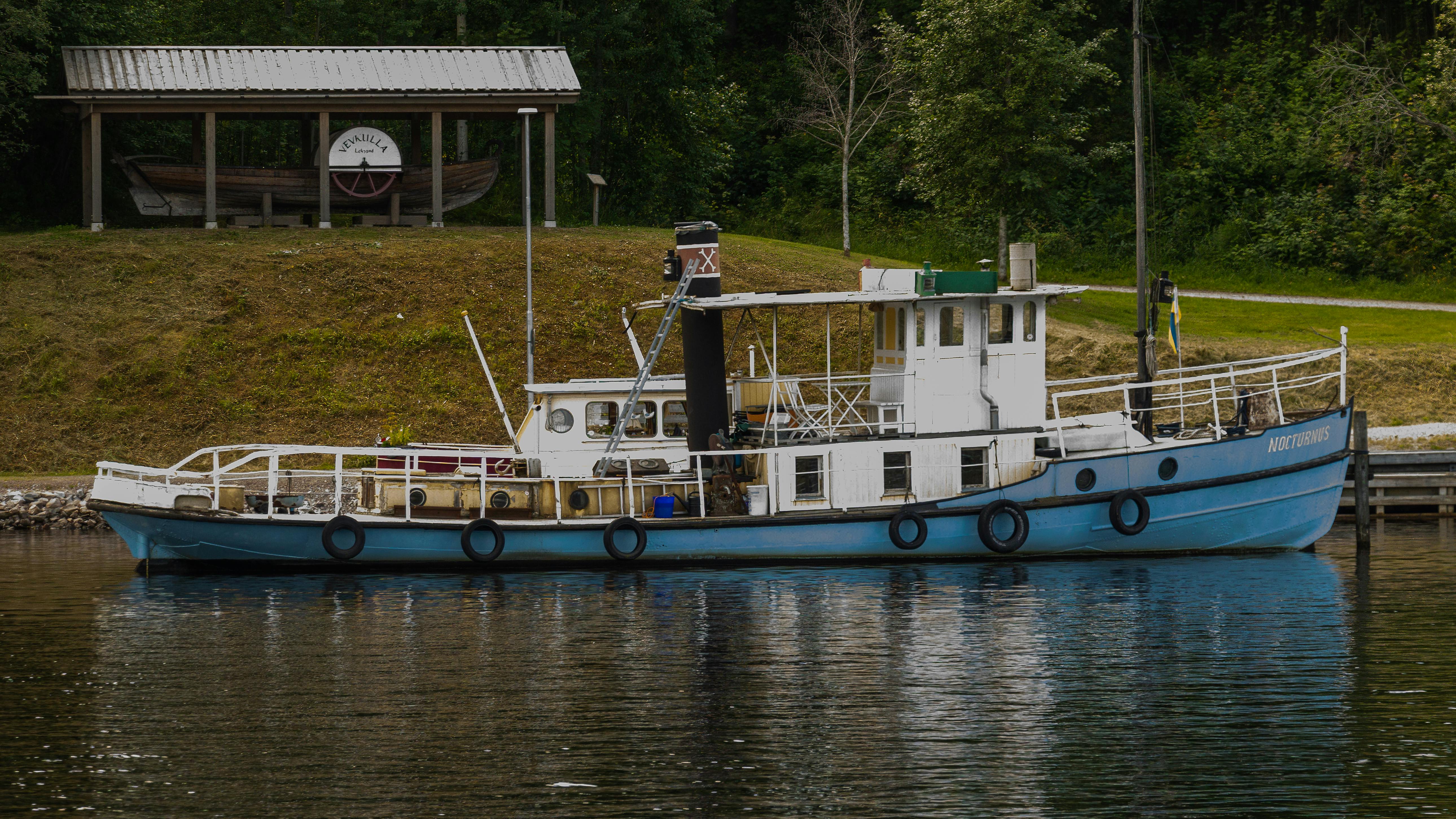 Blue Tugboat on Dock · Free Stock Photo