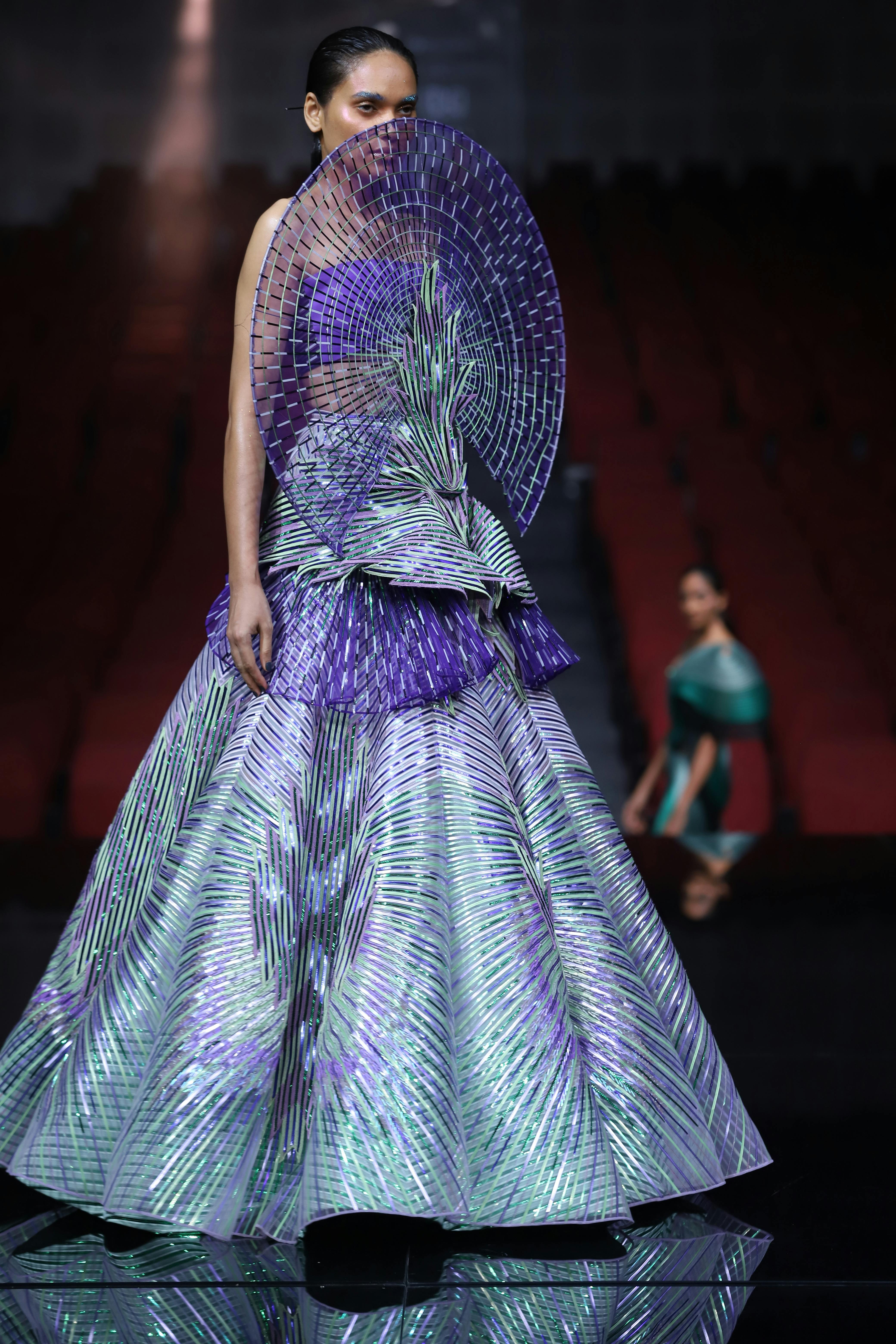 Woman in Purple and White Dress Walking on Runway · Free Stock Photo
