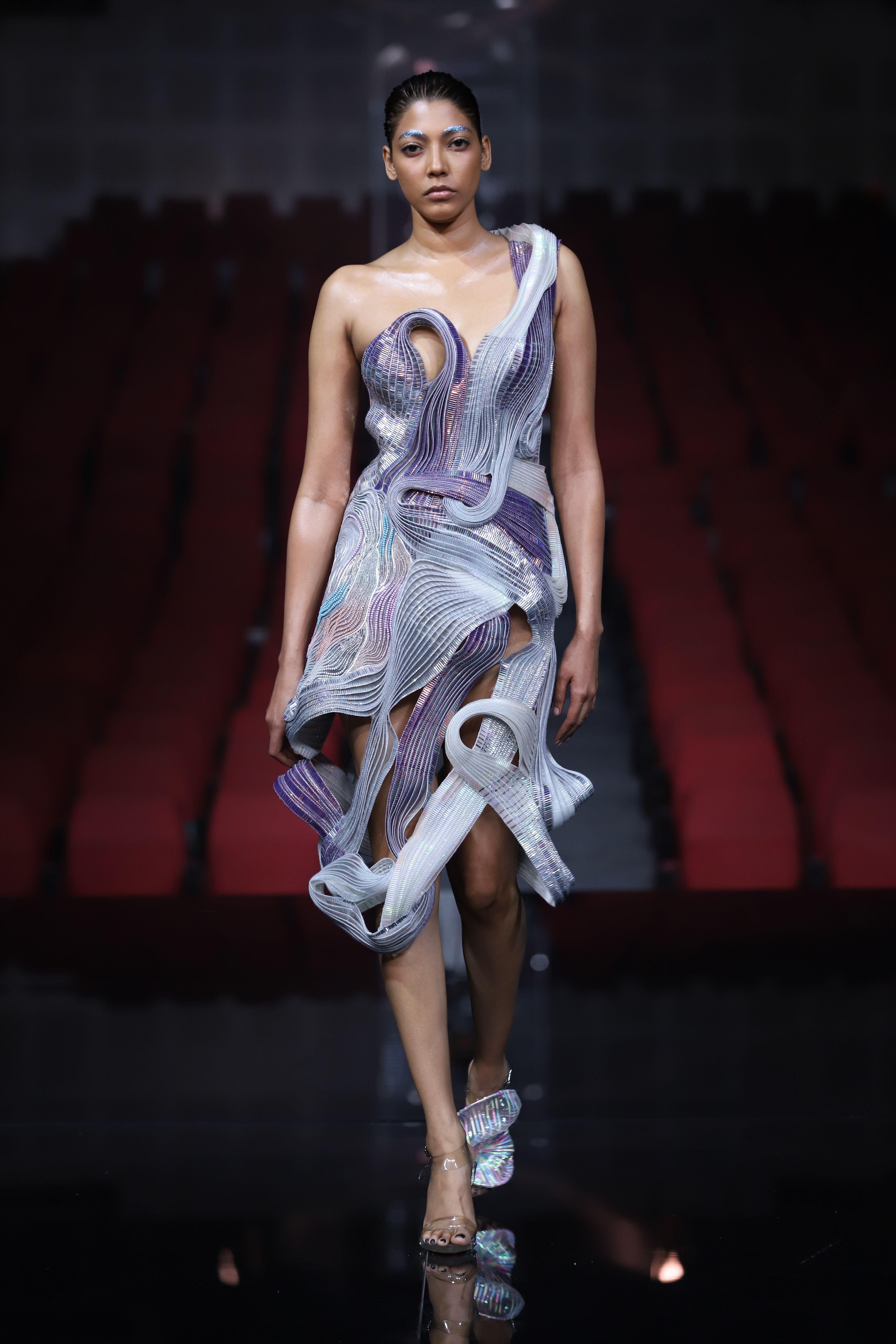 A Woman in White Dress Standing Draping Black Jacket Over Shoulders ...