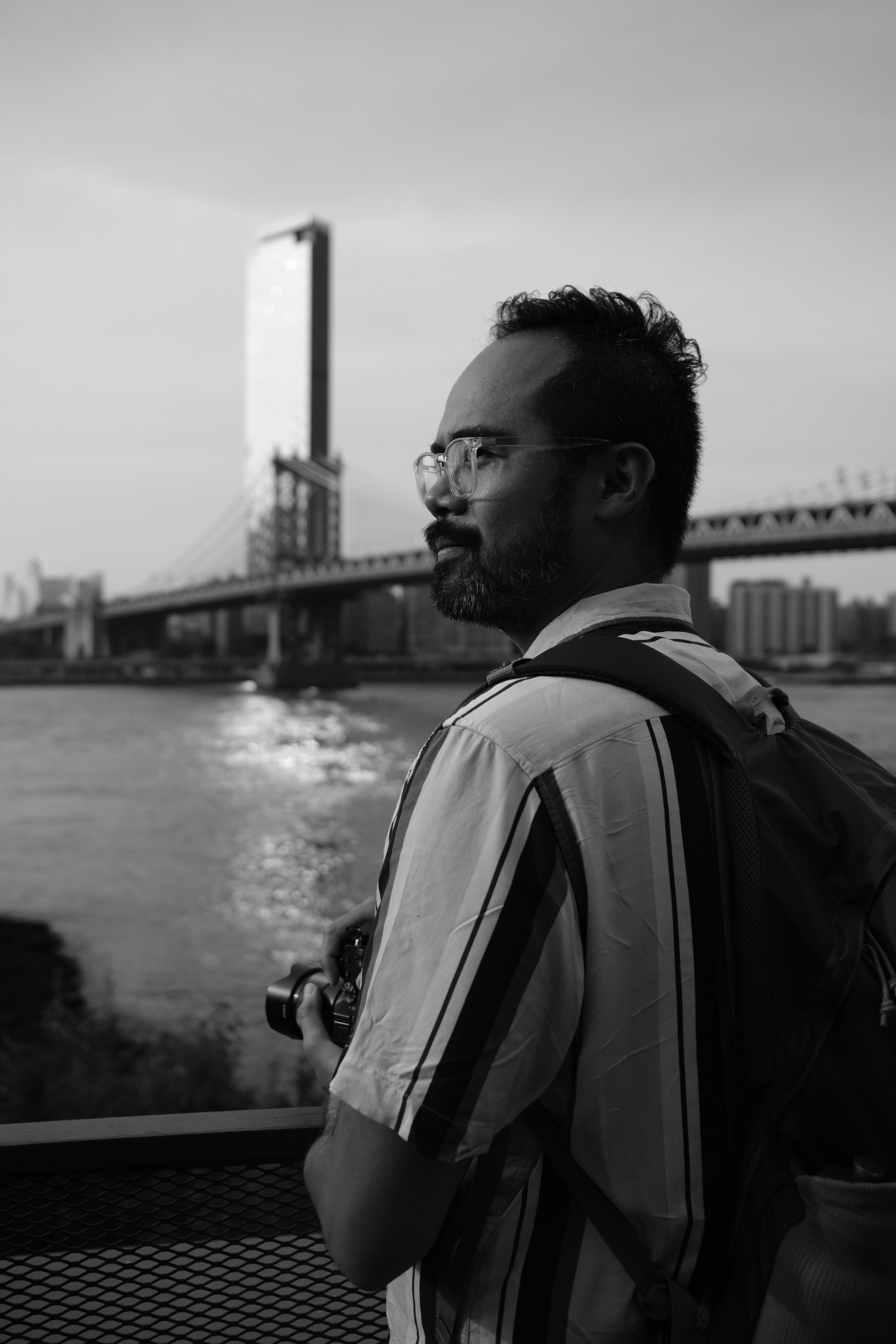 Grayscale Photo of a Man in Striped Shirt · Free Stock Photo
