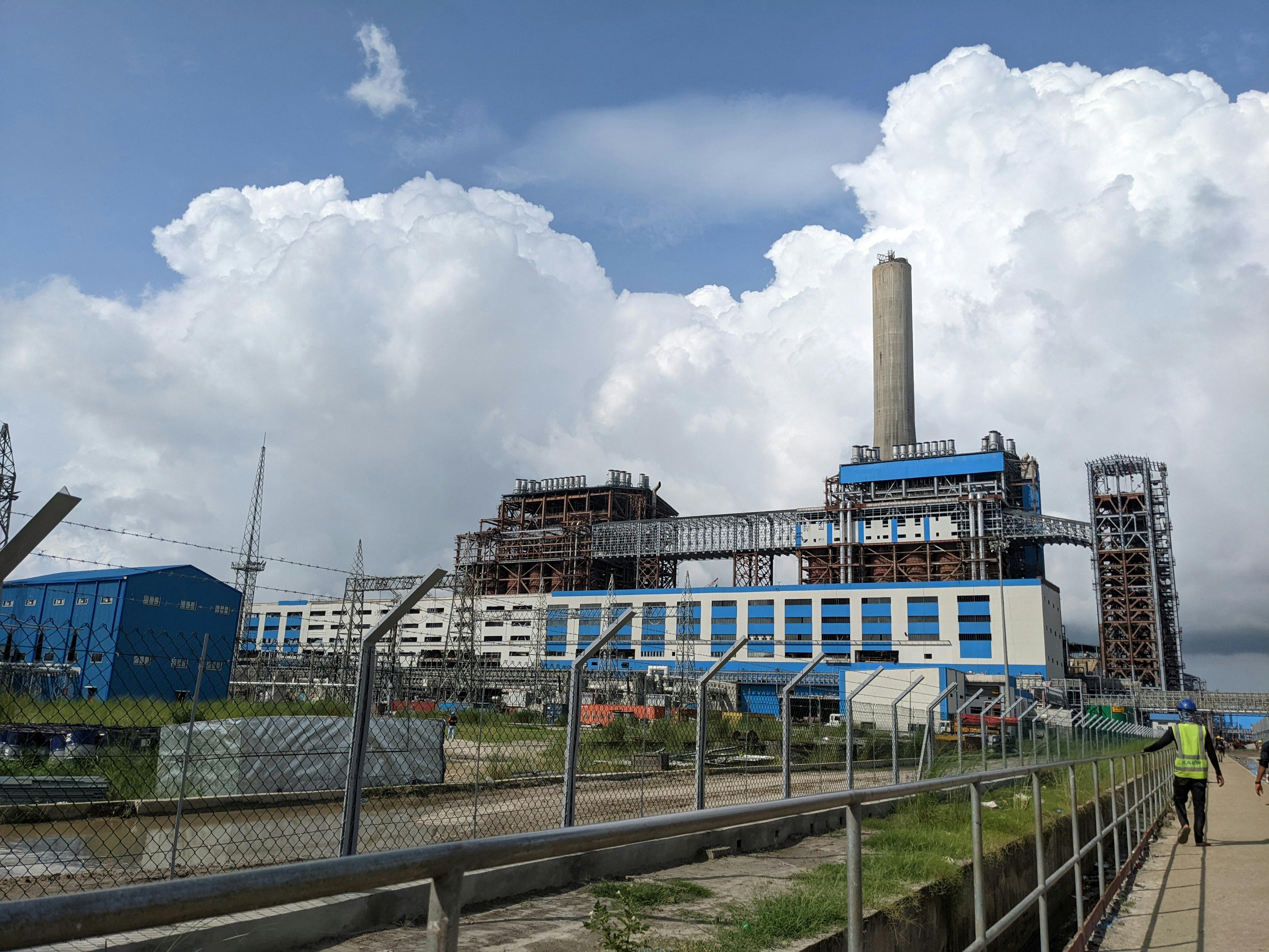 A Factory under a Cloudy Sky · Free Stock Photo