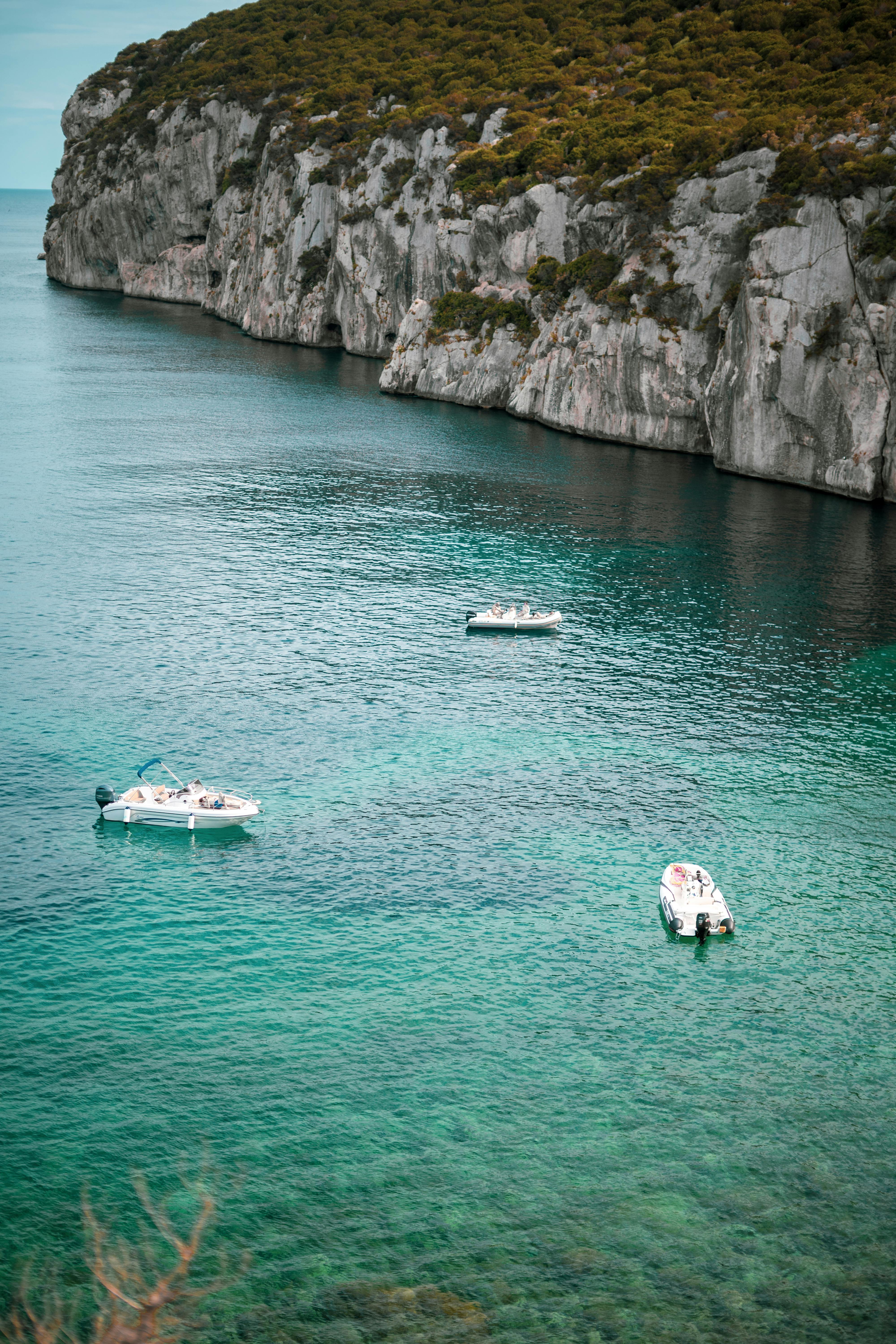Motor Boats on the Sea Bay Near the Coastal Cliff · Free Stock Photo