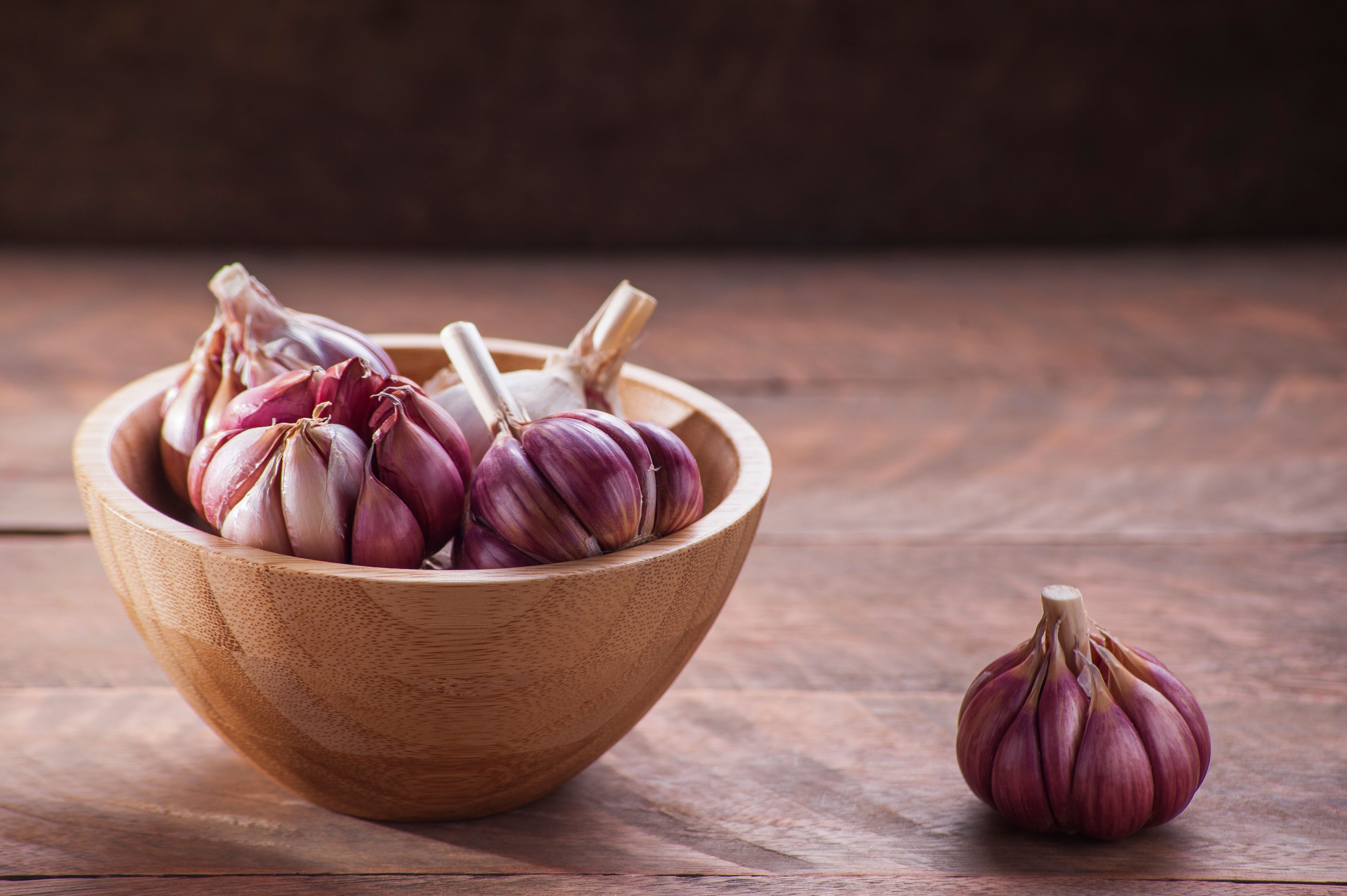 A Wooden Bowl Filled With Garlic · Free Stock Photo