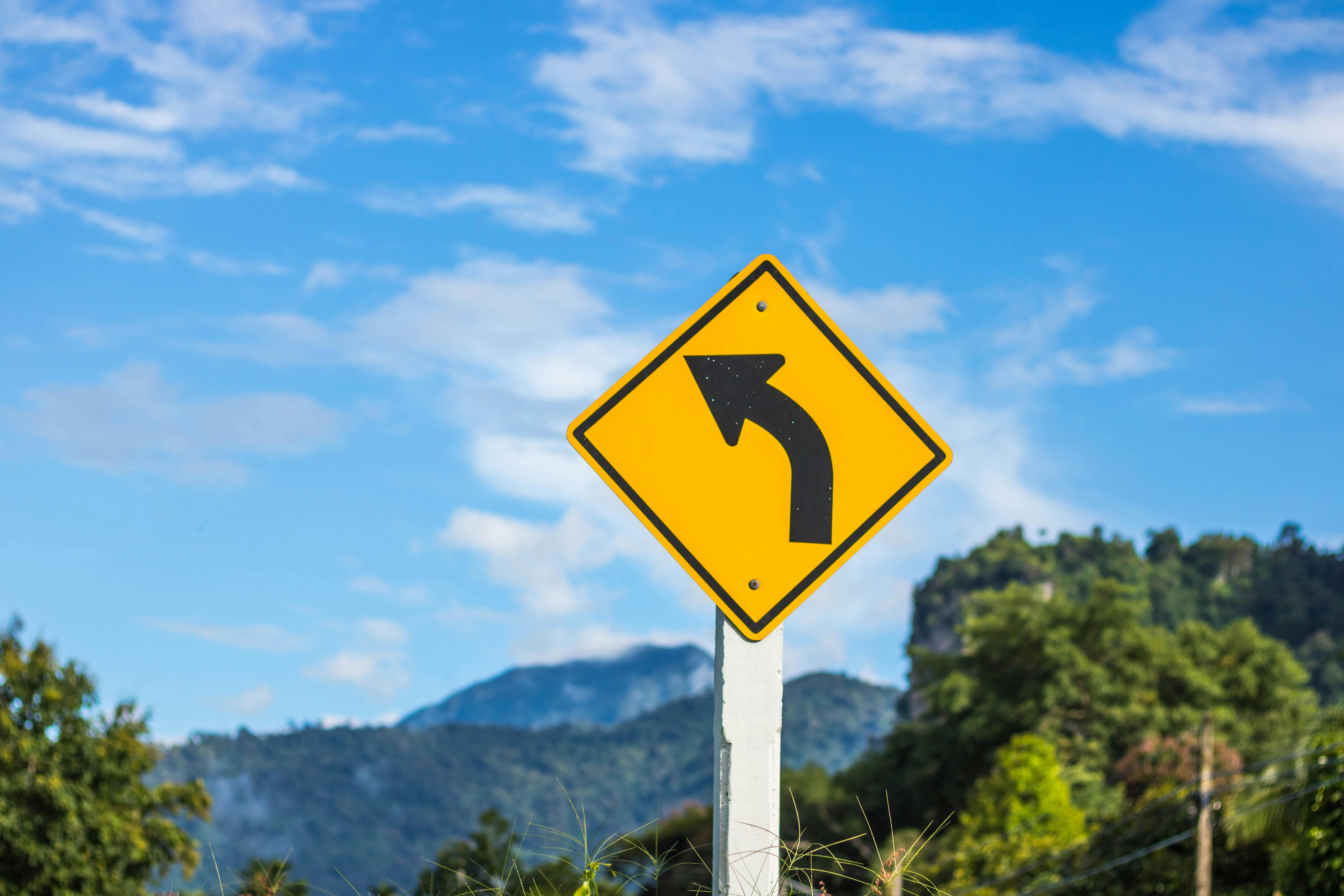White Road Arrow Sign · Free Stock Photo