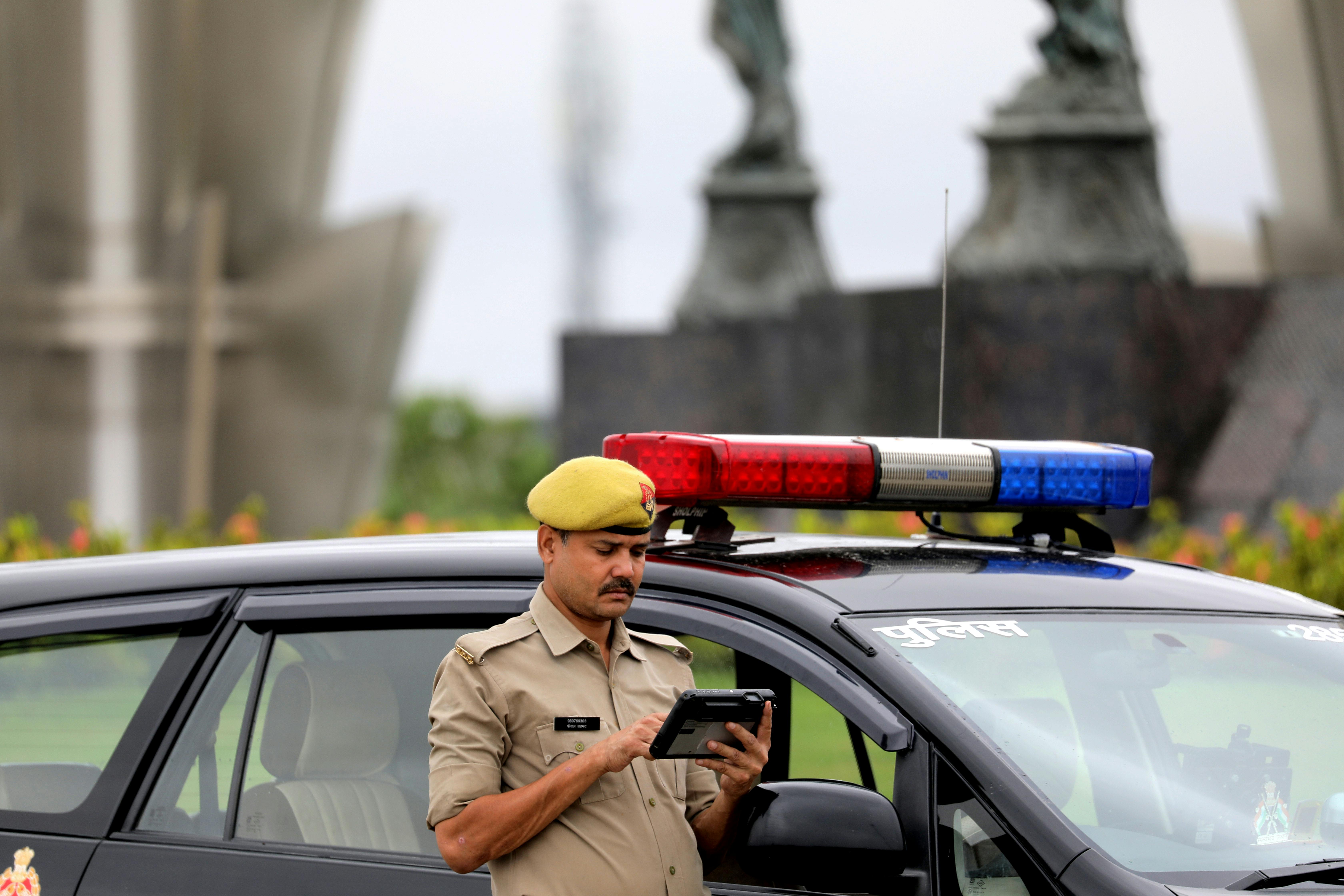 A Policeman Driving a Car · Free Stock Photo