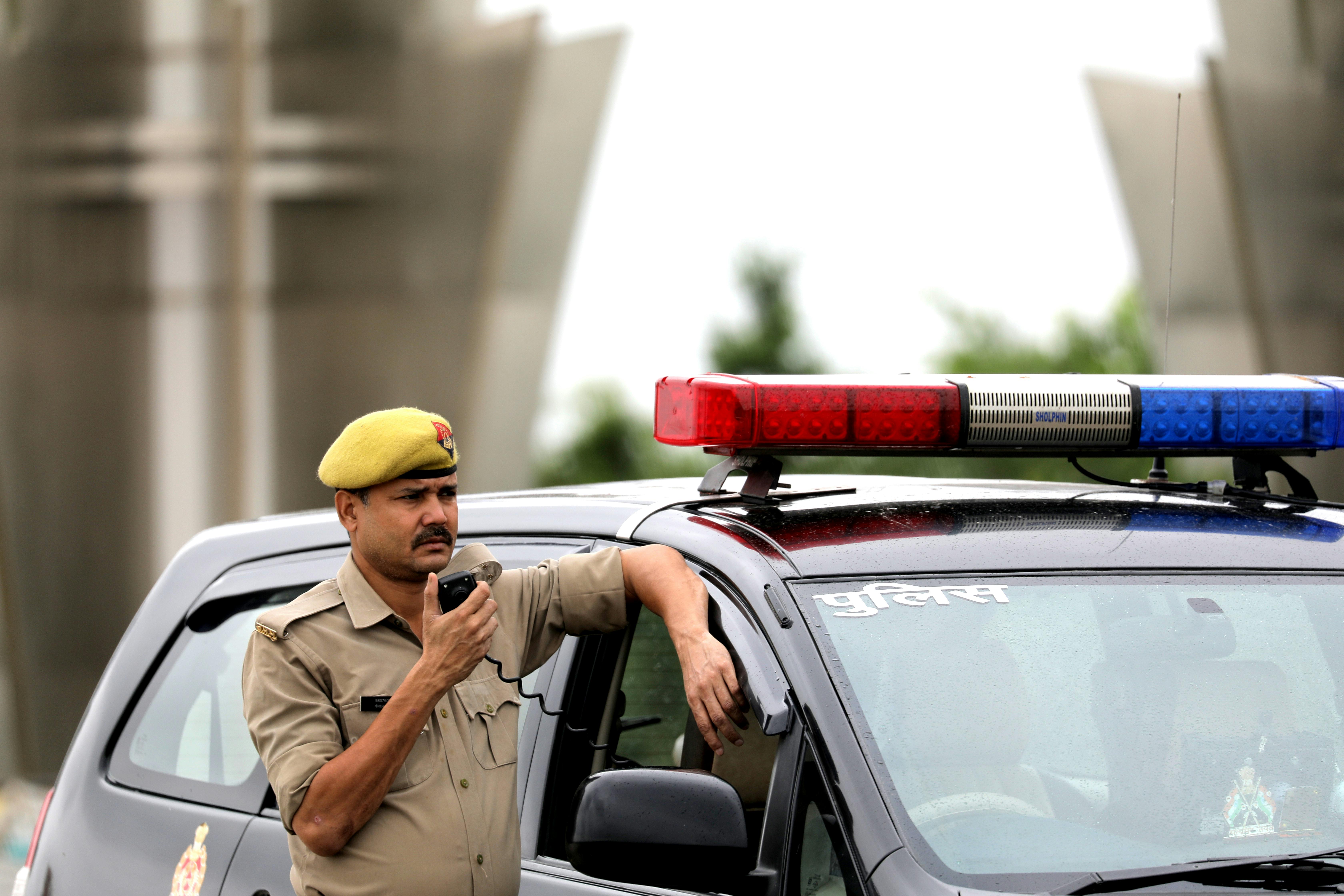 A Police Officer Wearing His Blue Uniform · Free Stock Photo