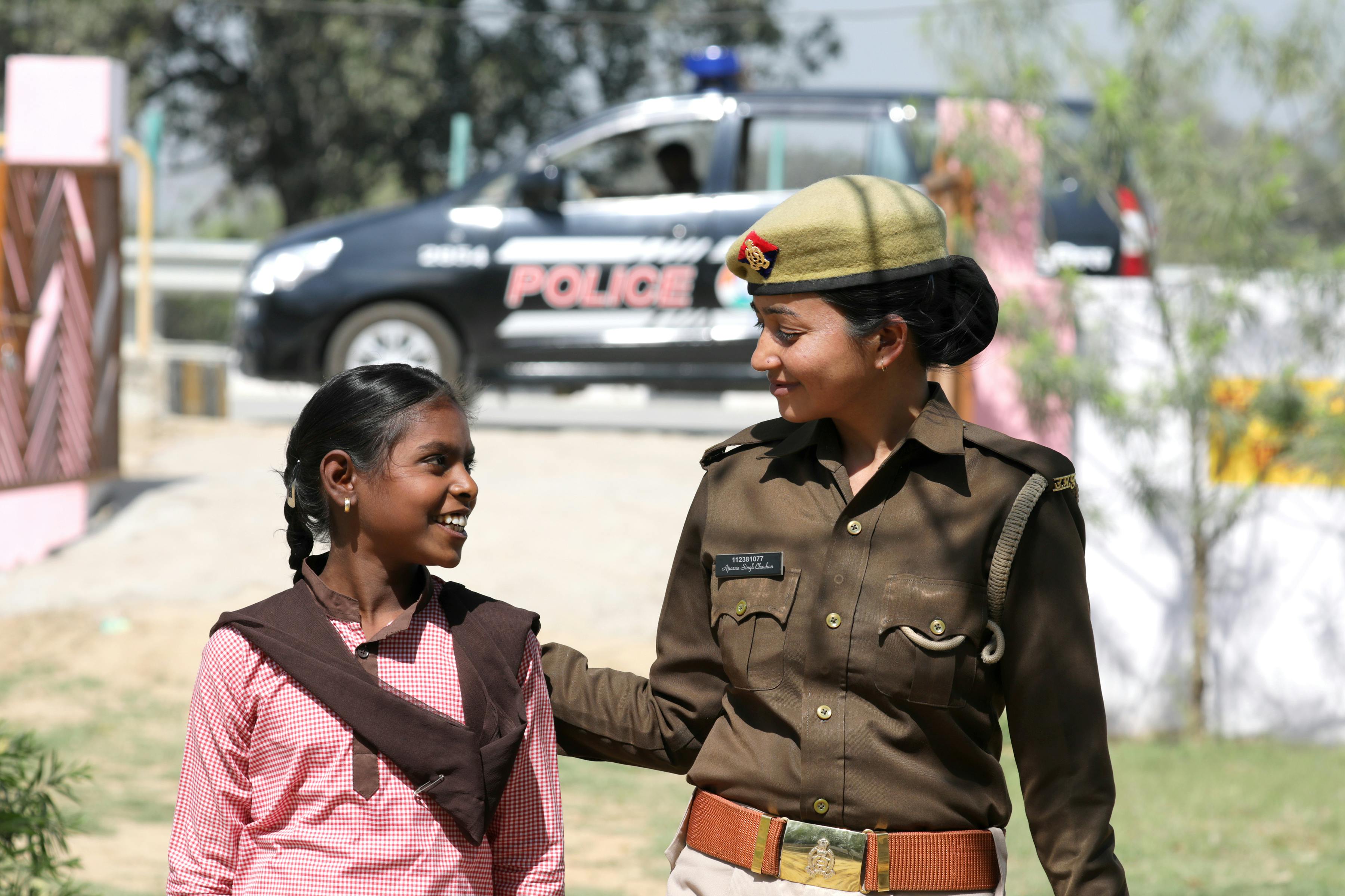 Policewoman Talking to a Kid · Free Stock Photo