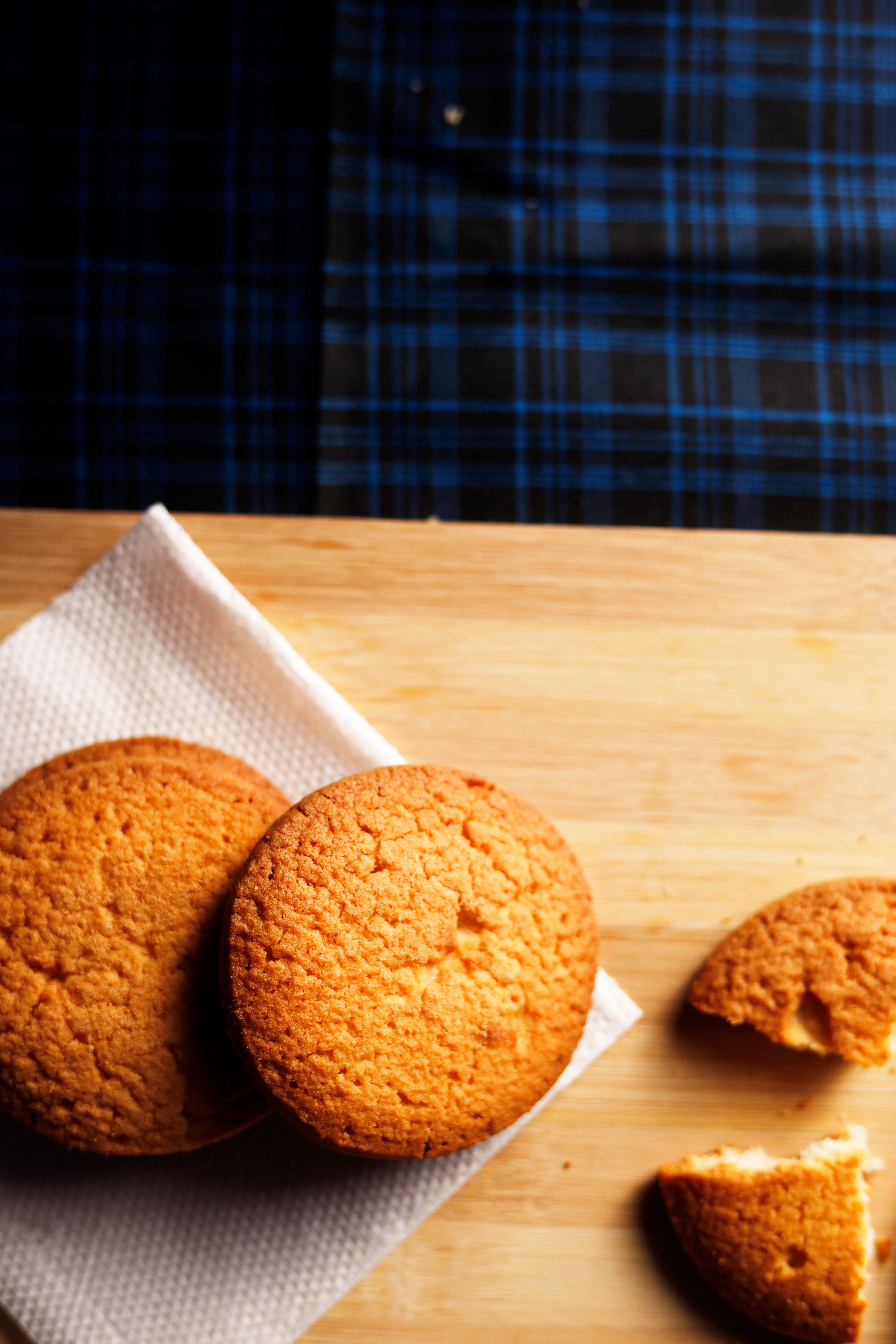 Brown Biscuits on Wooden Table · Free Stock Photo