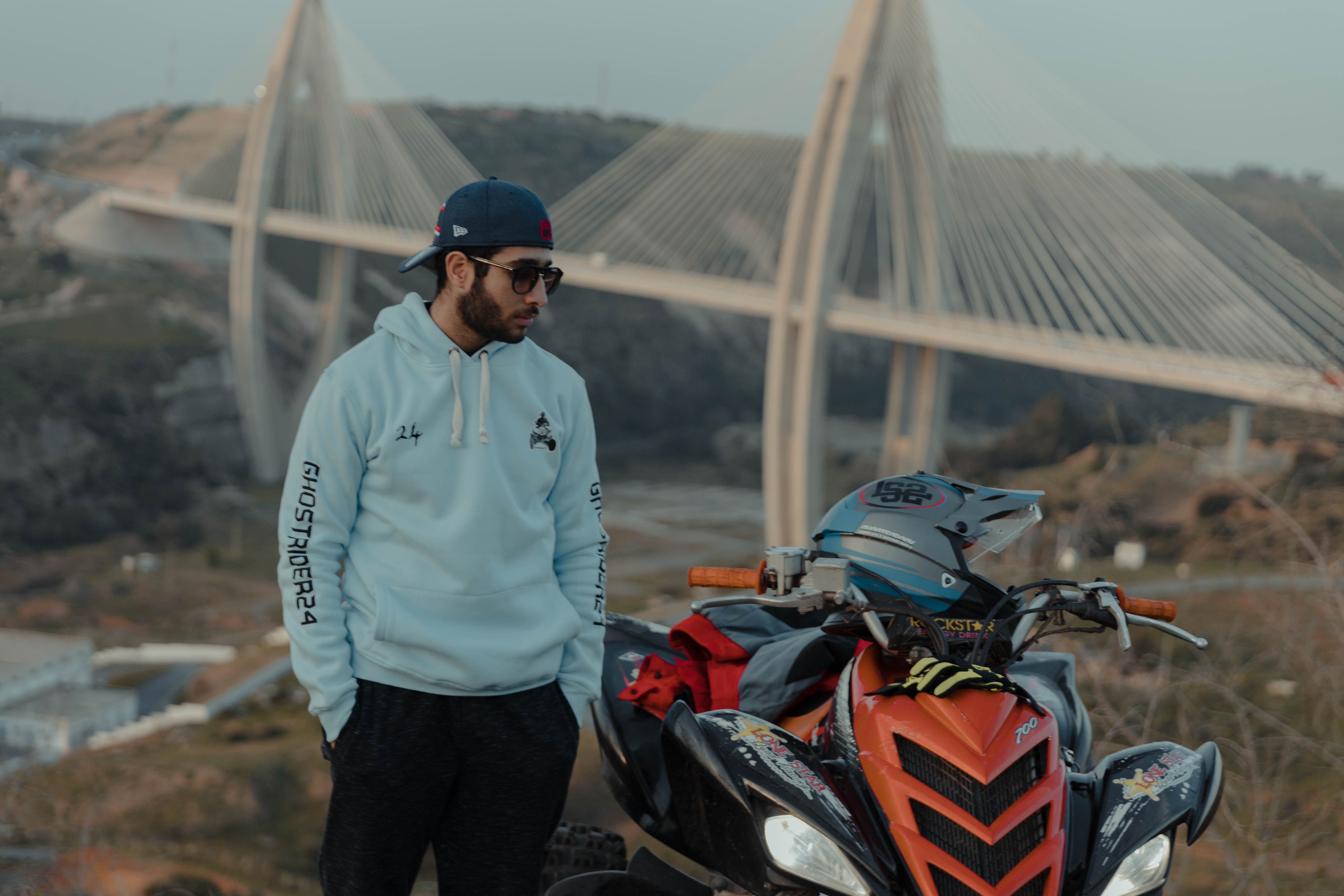 A Man Standing Beside an ATV · Free Stock Photo
