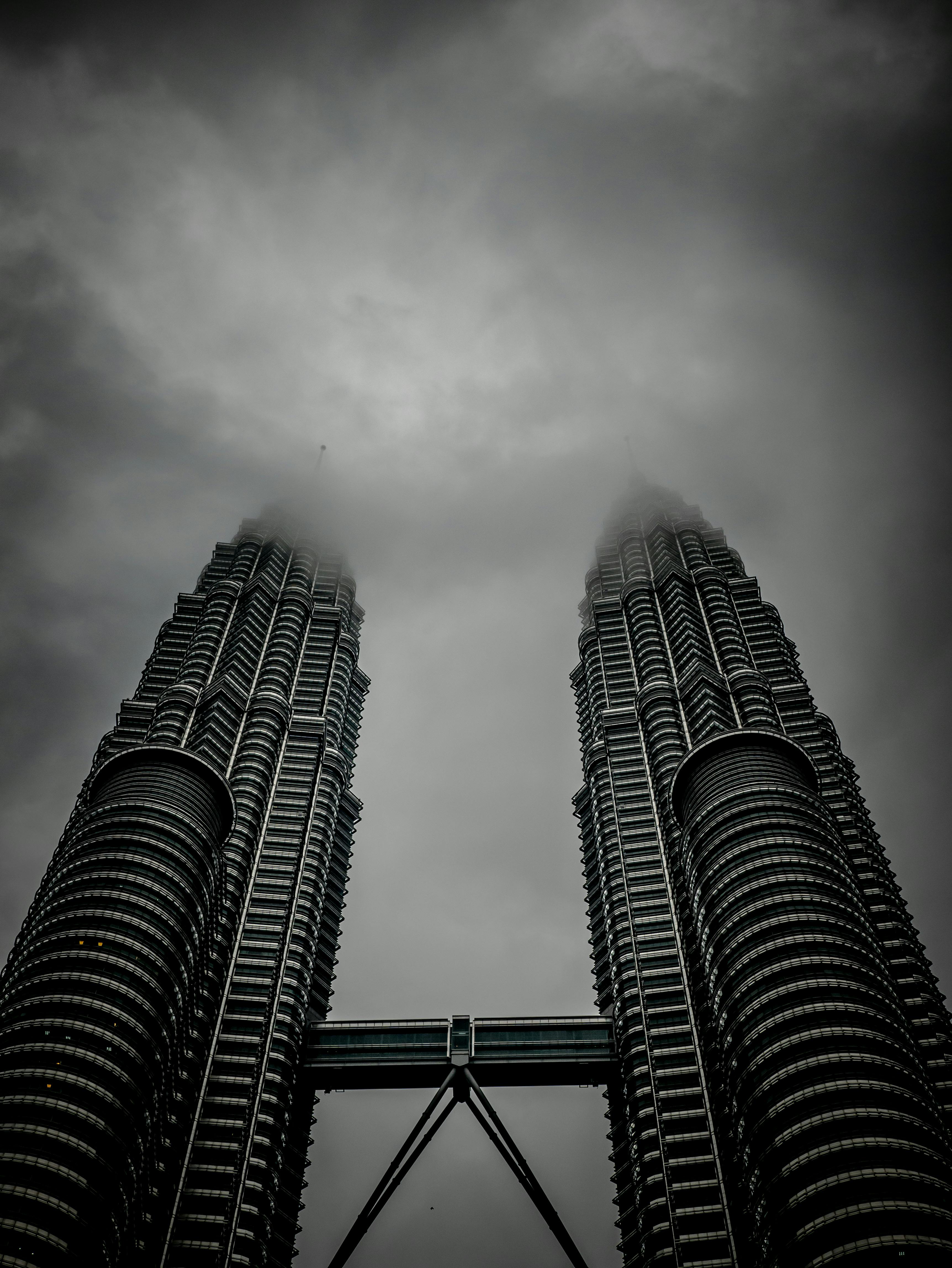 A Grayscale Photo of Petronas Twin Towers Under the Cloudy Sky · Free ...