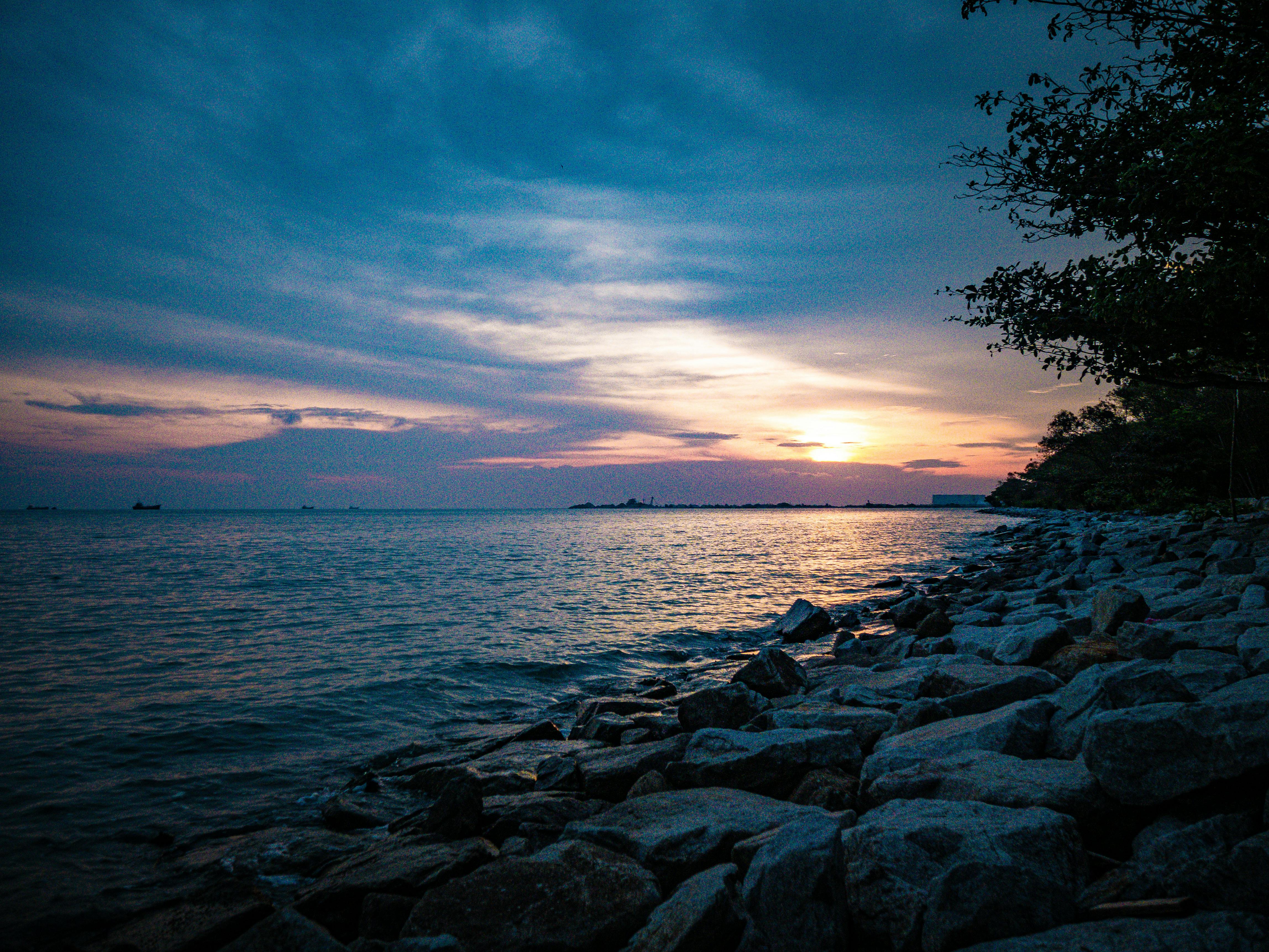 Gray Rocks Near Body of Water · Free Stock Photo