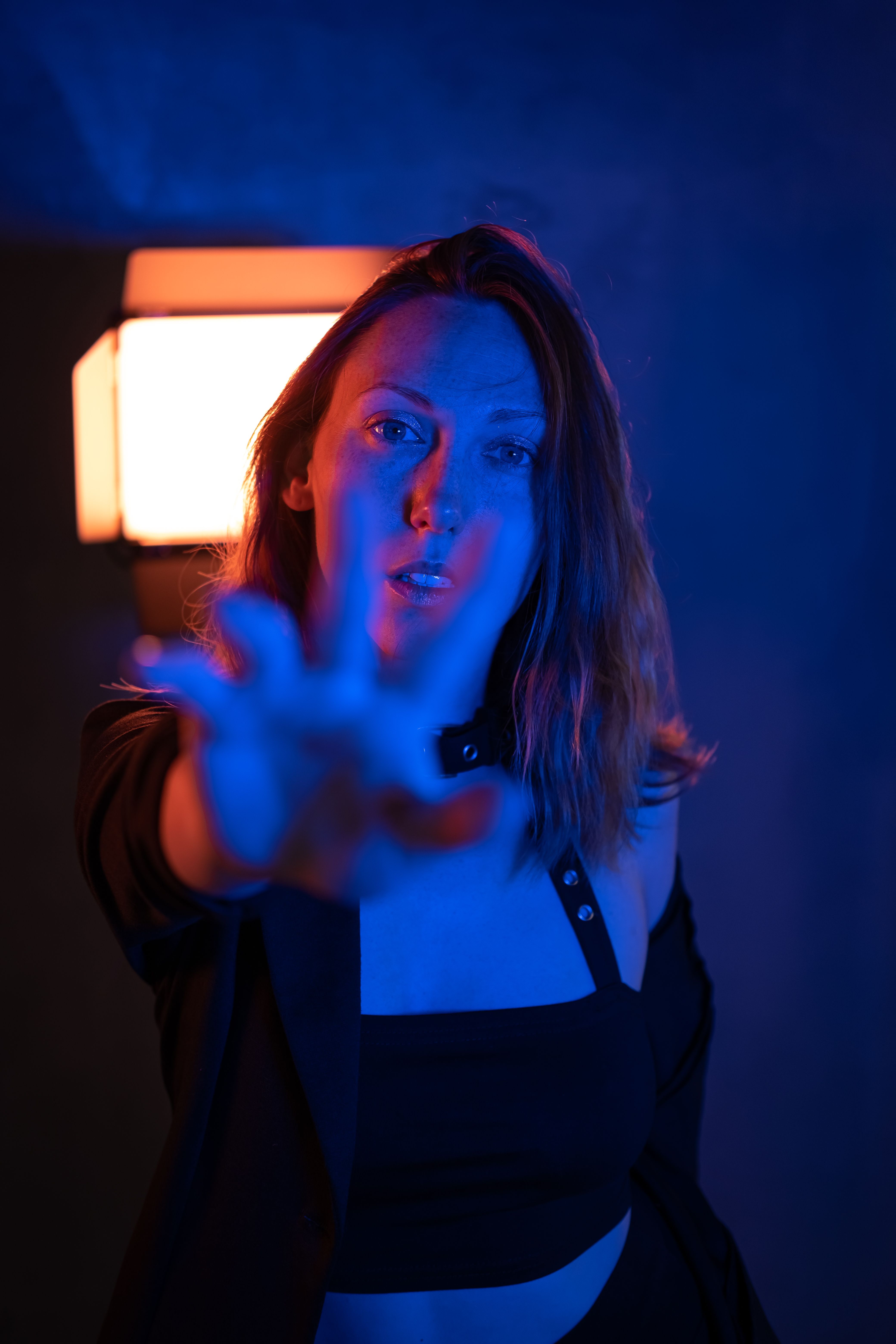 Photo of a Woman in Blue Electric Light · Free Stock Photo