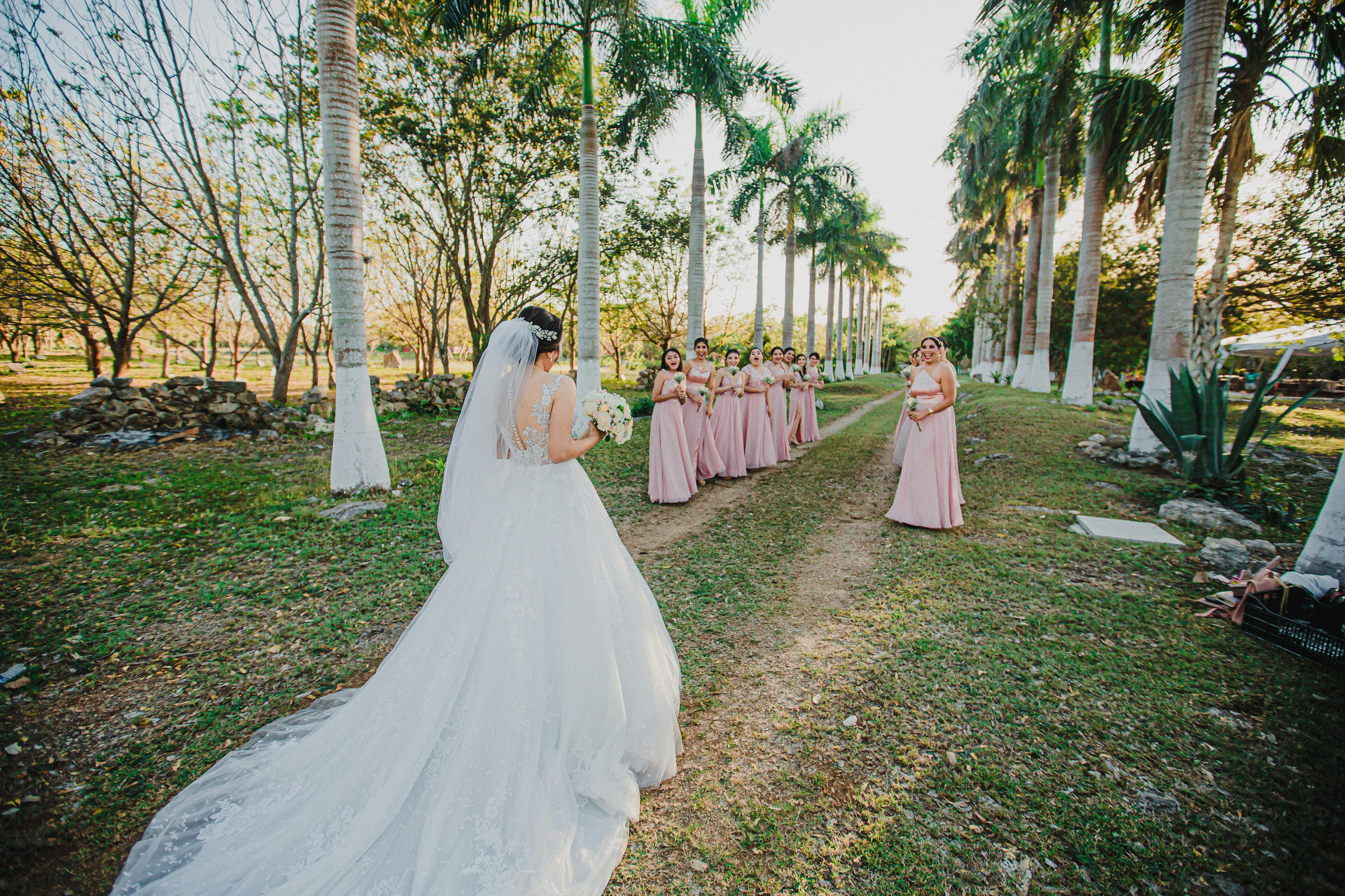Bride Walking on Unpaved Pathway · Free Stock Photo