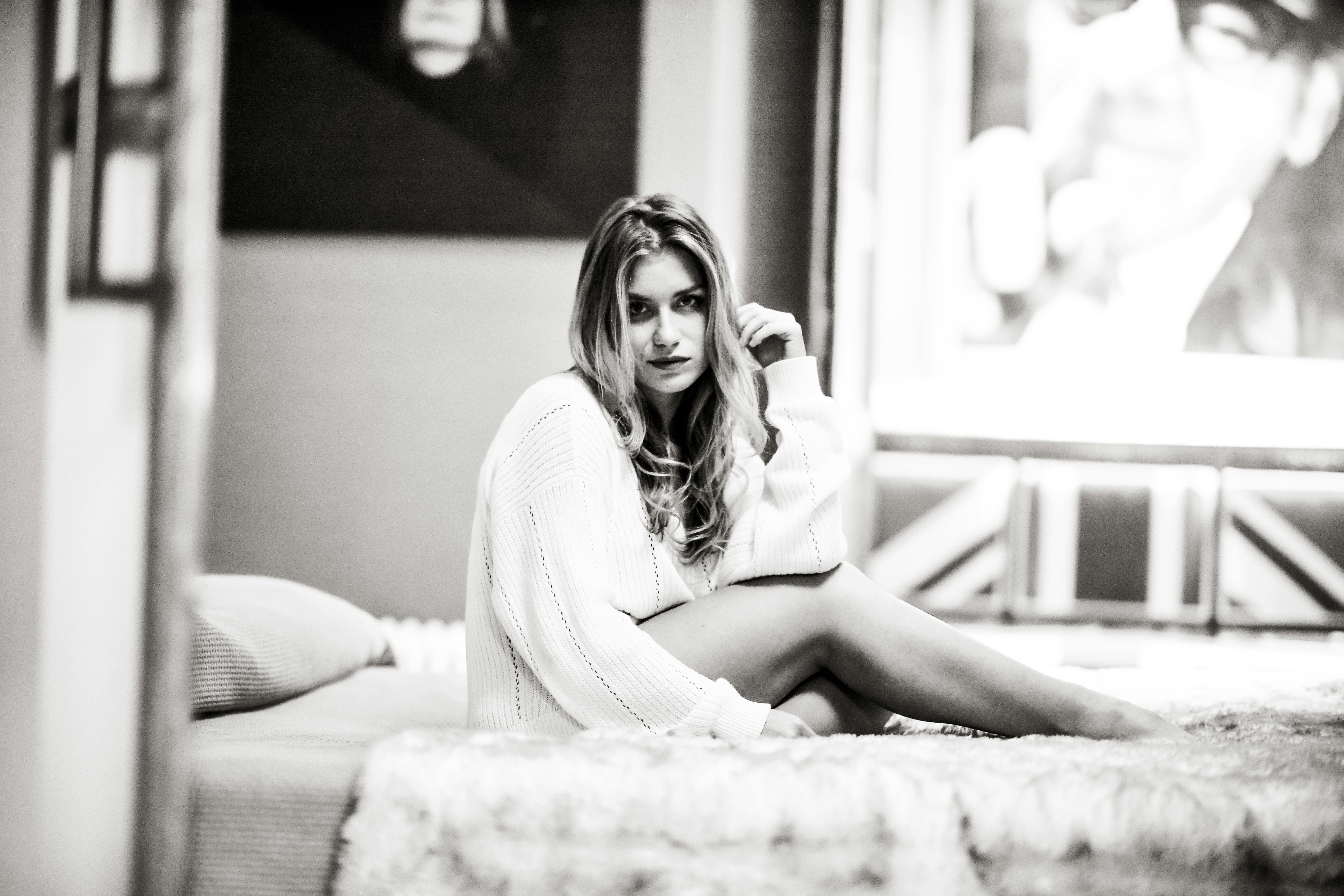 Grayscale Photography of Woman raising her hand · Free Stock Photo