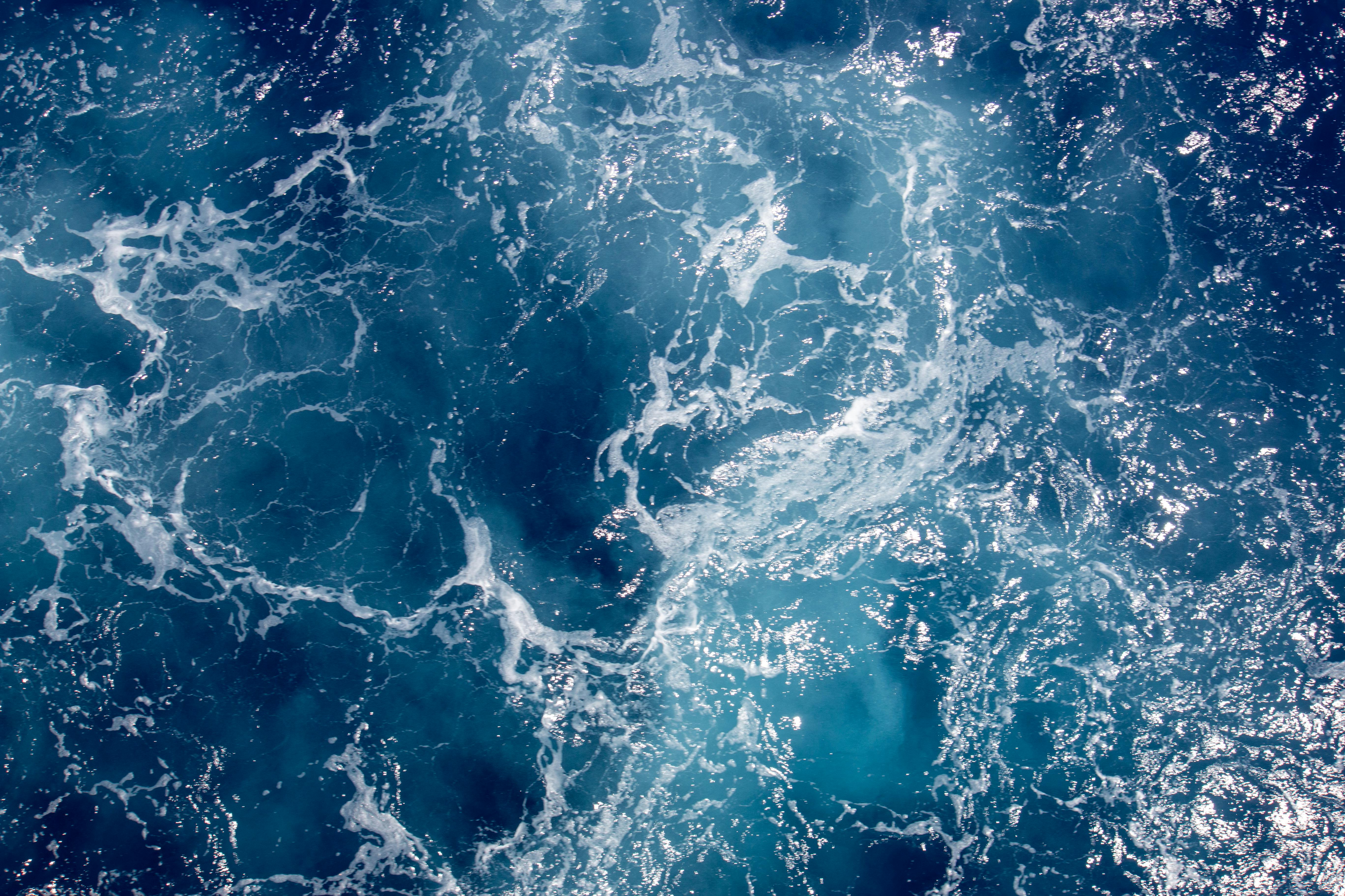 Drone Shot of a Sea with Seafoam · Free Stock Photo