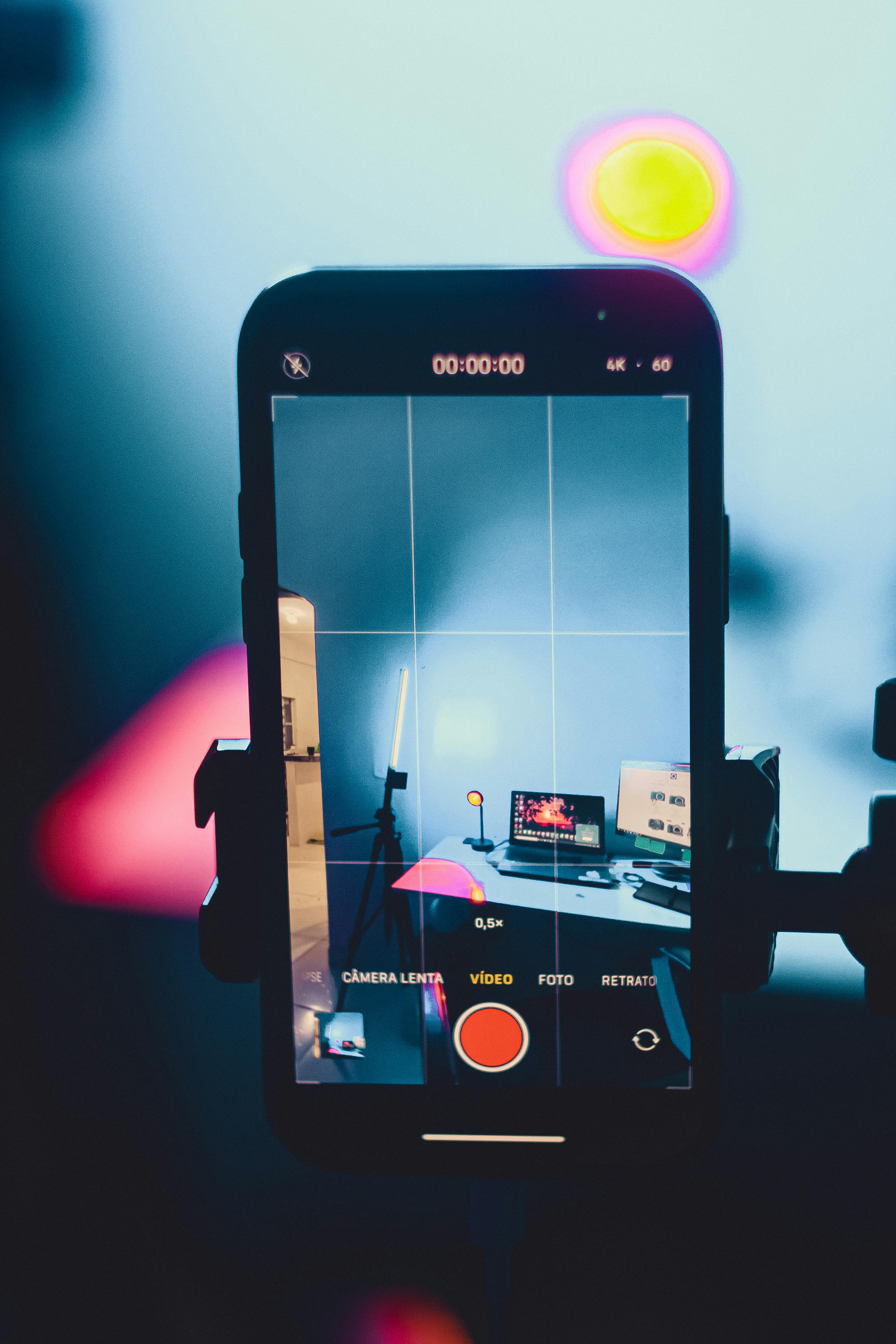 Recording Video of Desk with Cellphone · Free Stock Photo