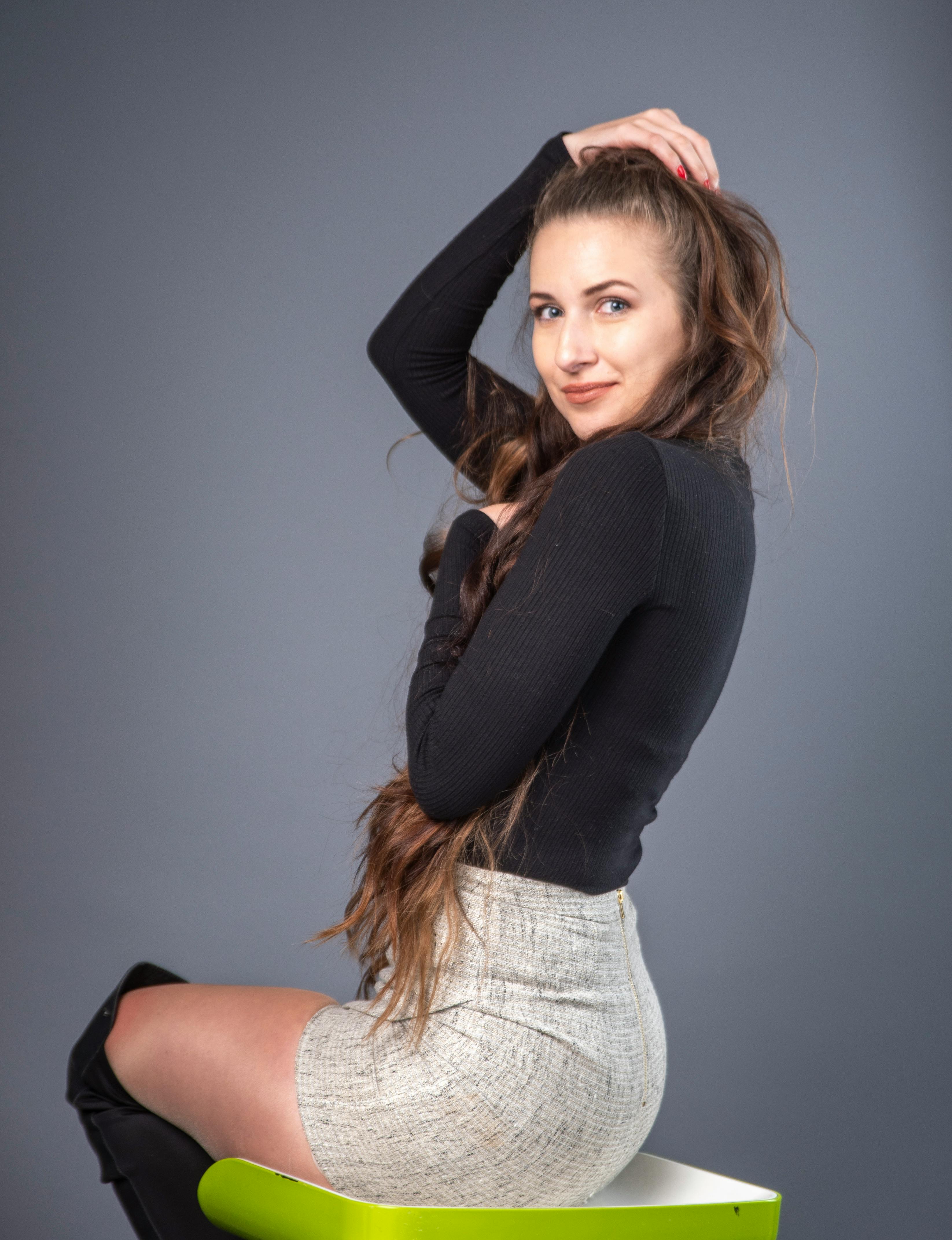 A Woman Sitting on the Chair · Free Stock Photo