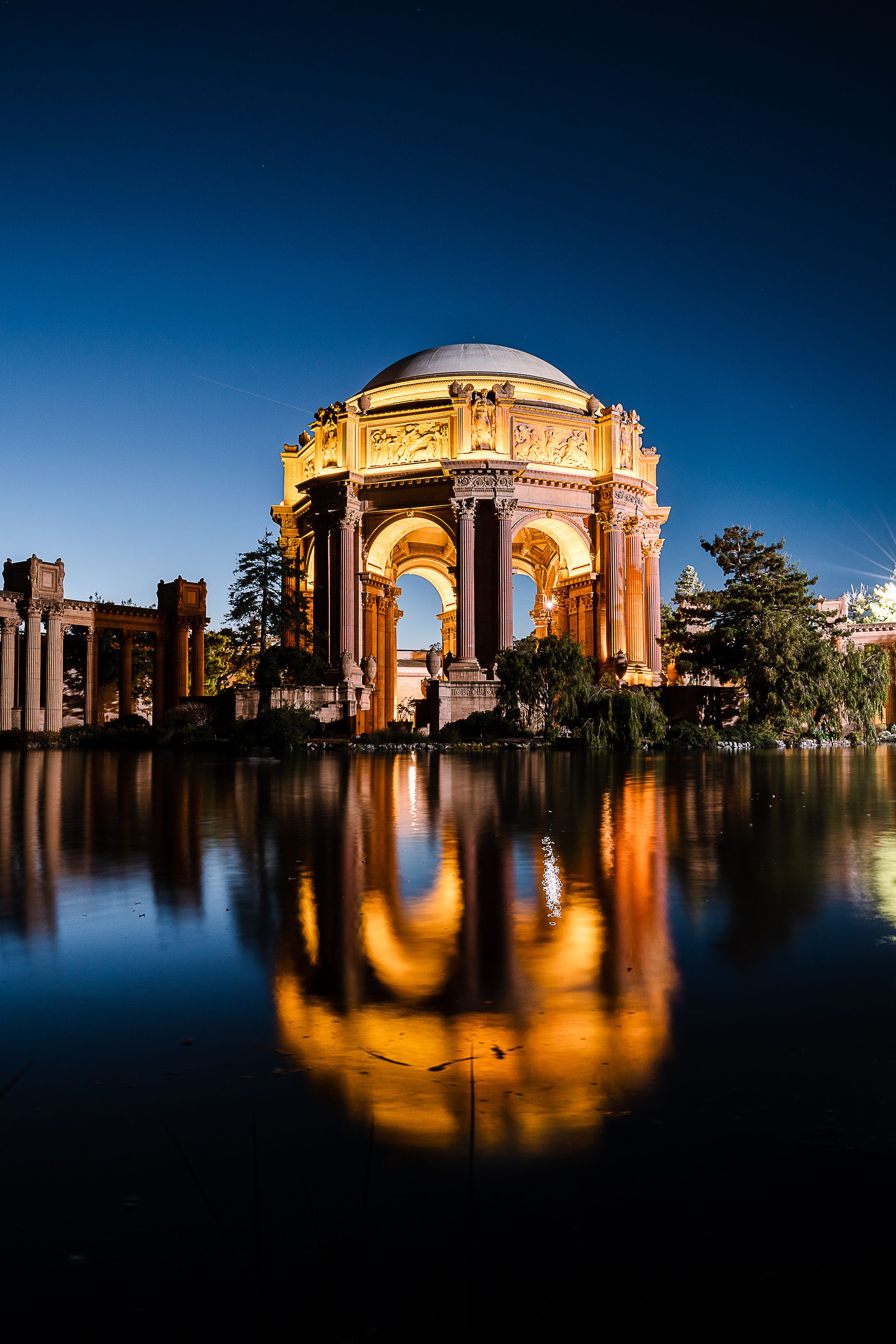 Ancient Building in Lights near Water · Free Stock Photo