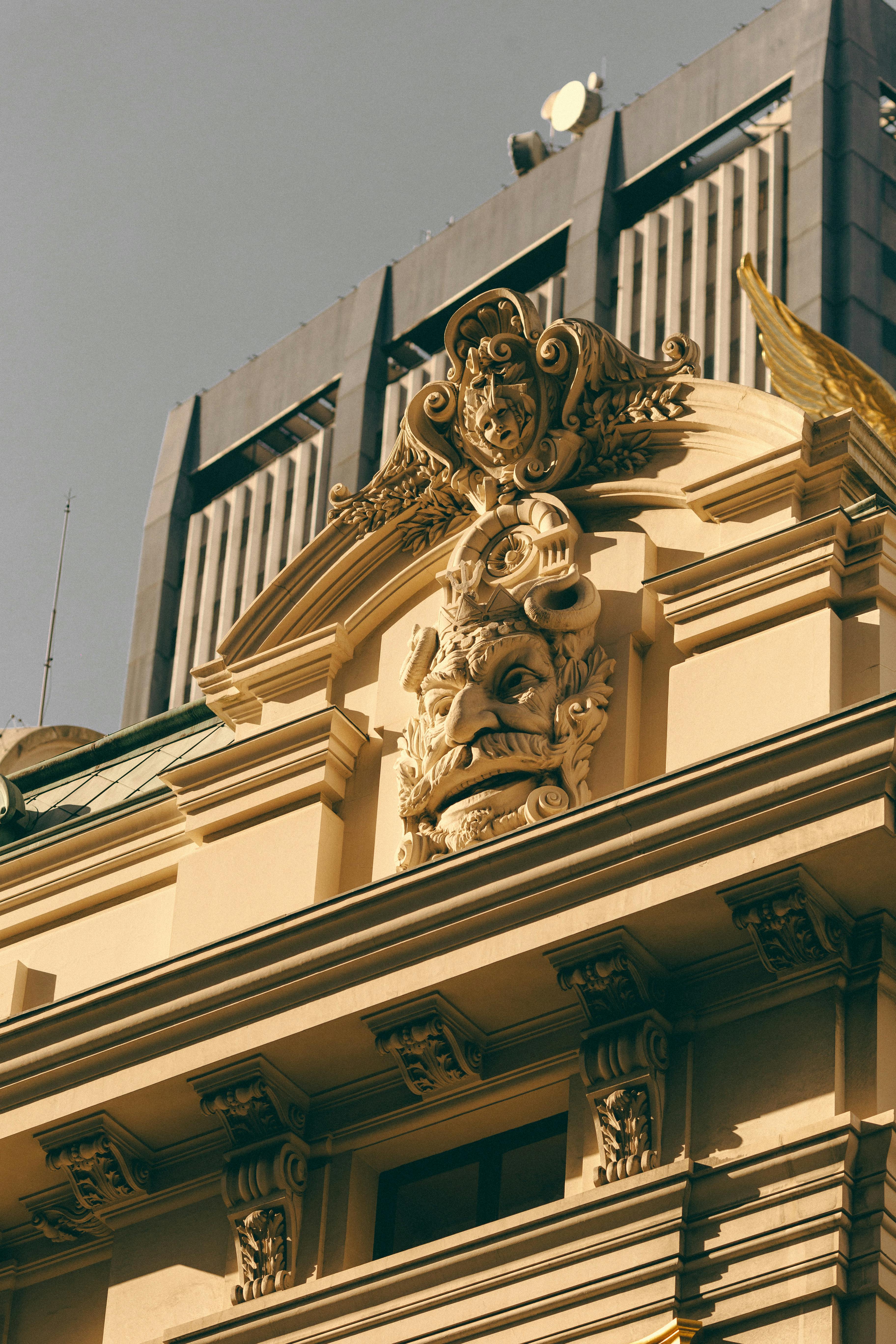 Golden Sculptures on Top of Building · Free Stock Photo
