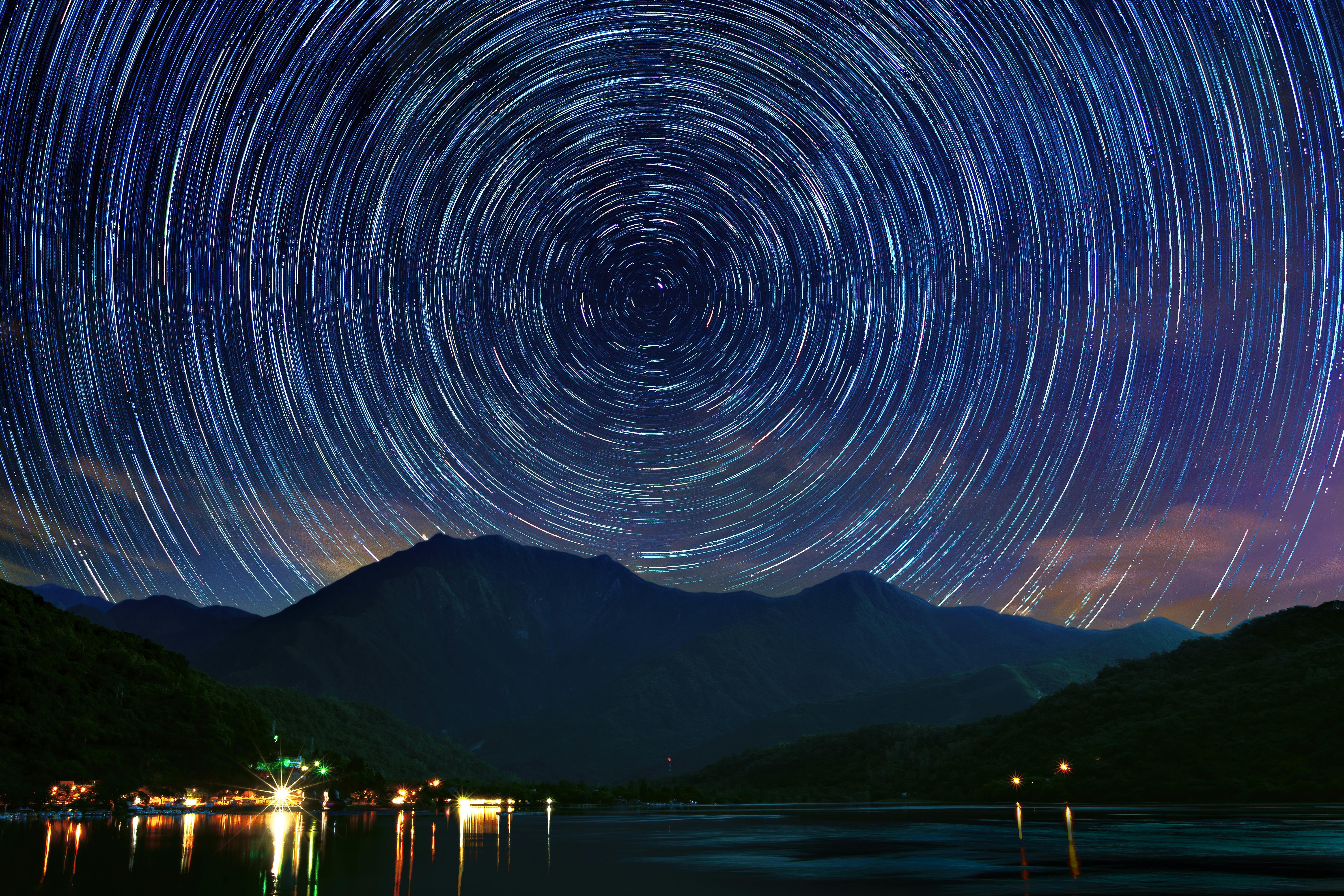 Long Exposure Photo of Starry Sky above Bay · Free Stock Photo