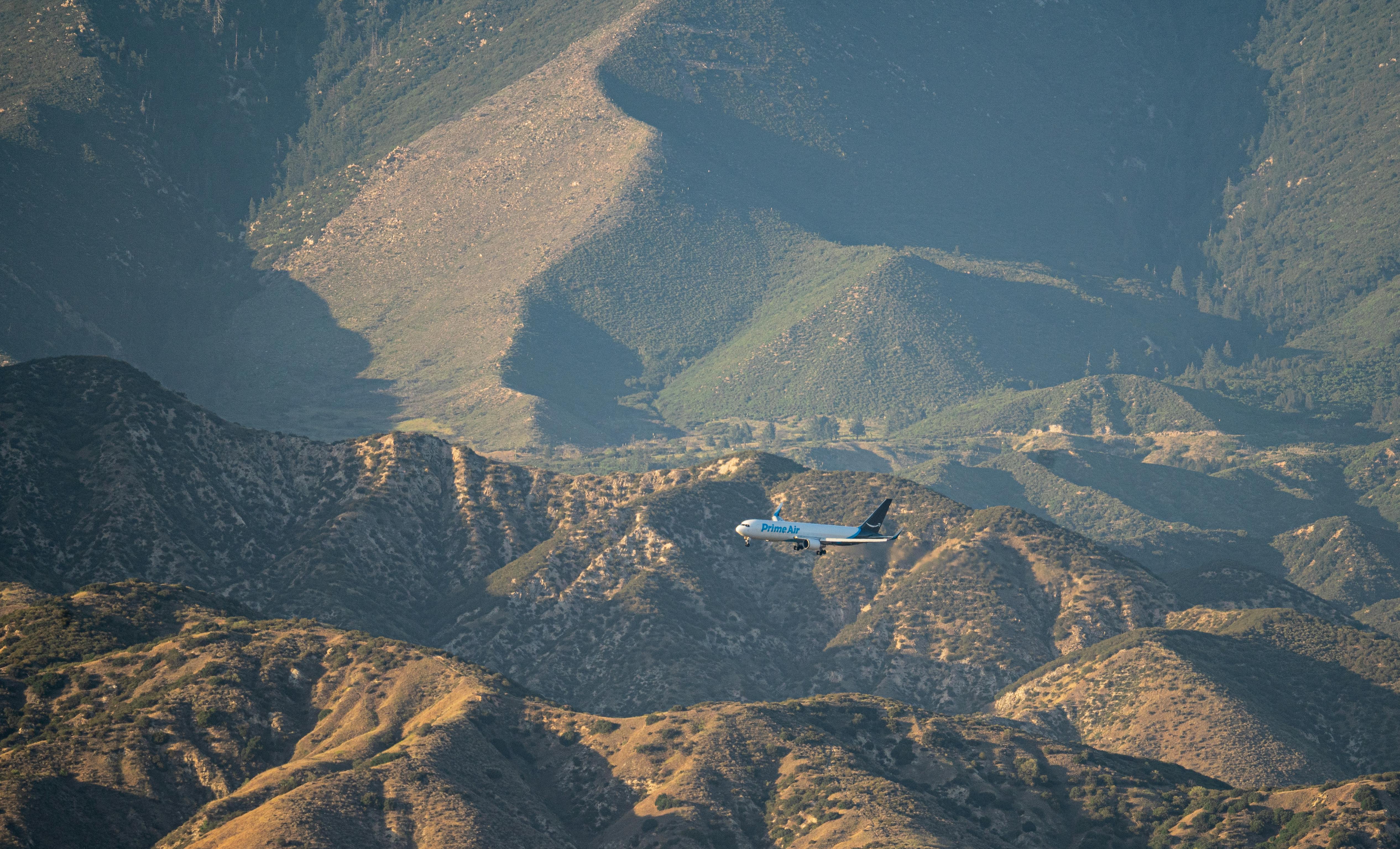 Aerial View of an Airplane Flying above Mountains · Free Stock Photo