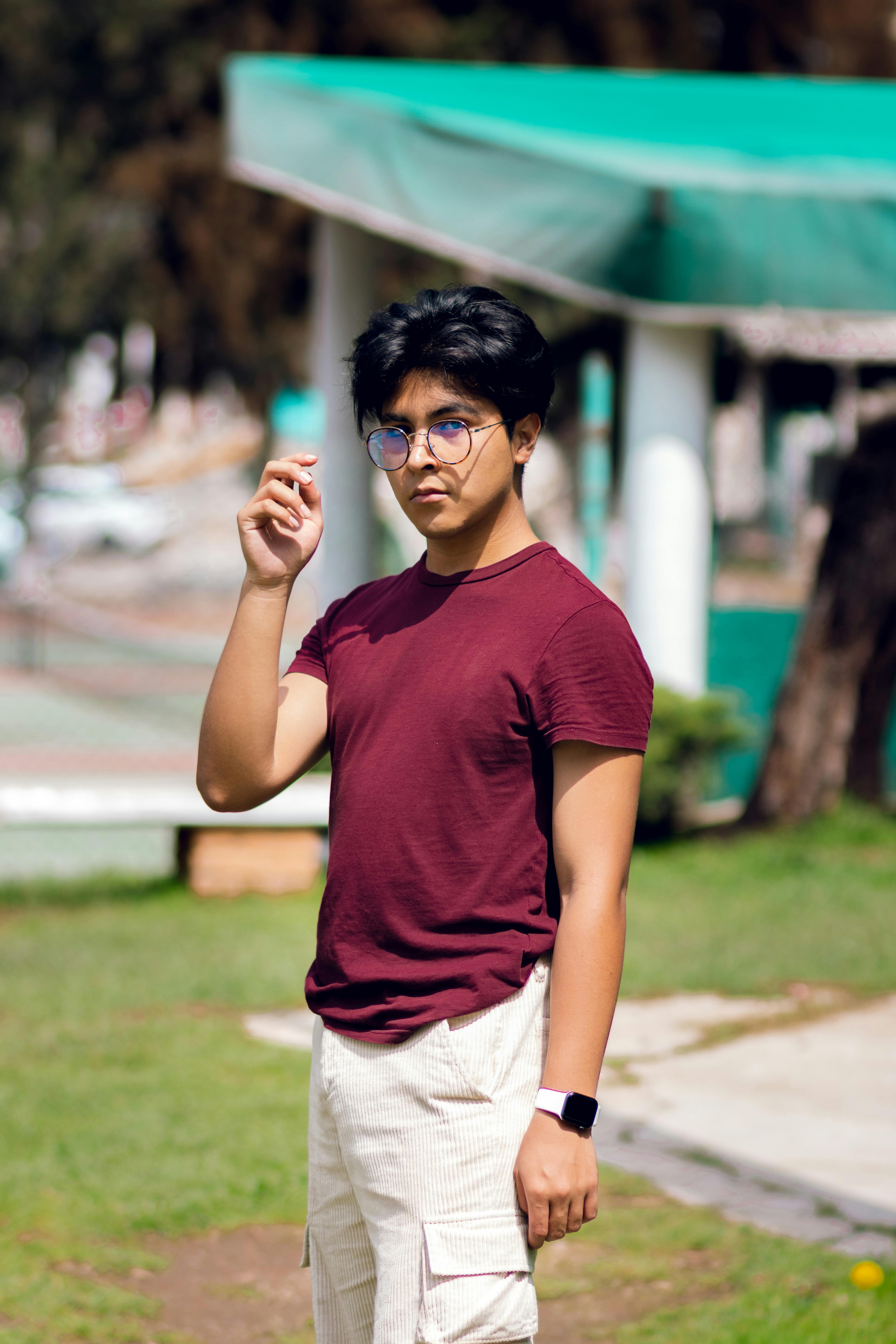 Man in Maroon Shirt With Praying Hands · Free Stock Photo