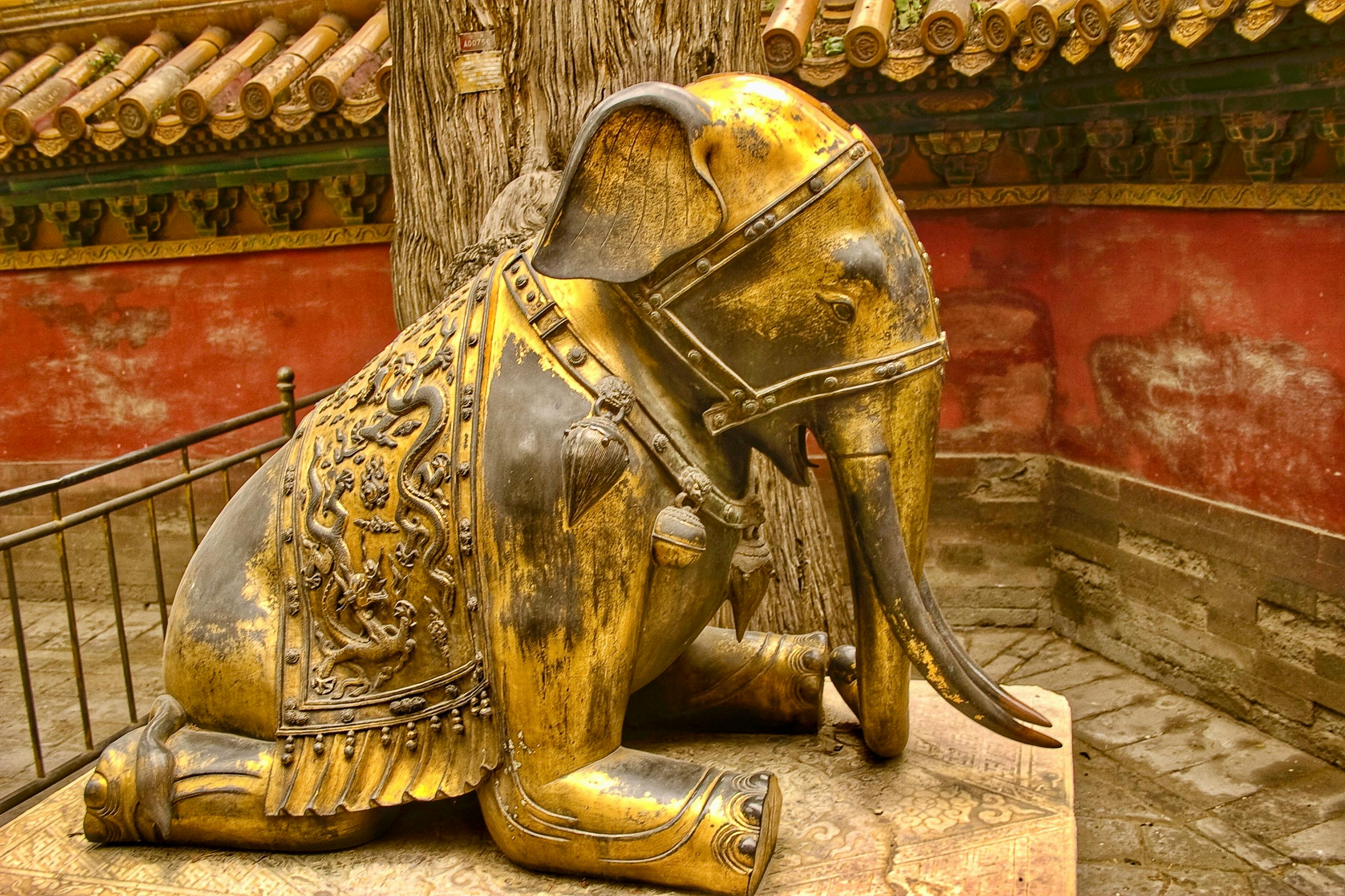 Gold Elephant Sculpture Beside a Tree · Free Stock Photo