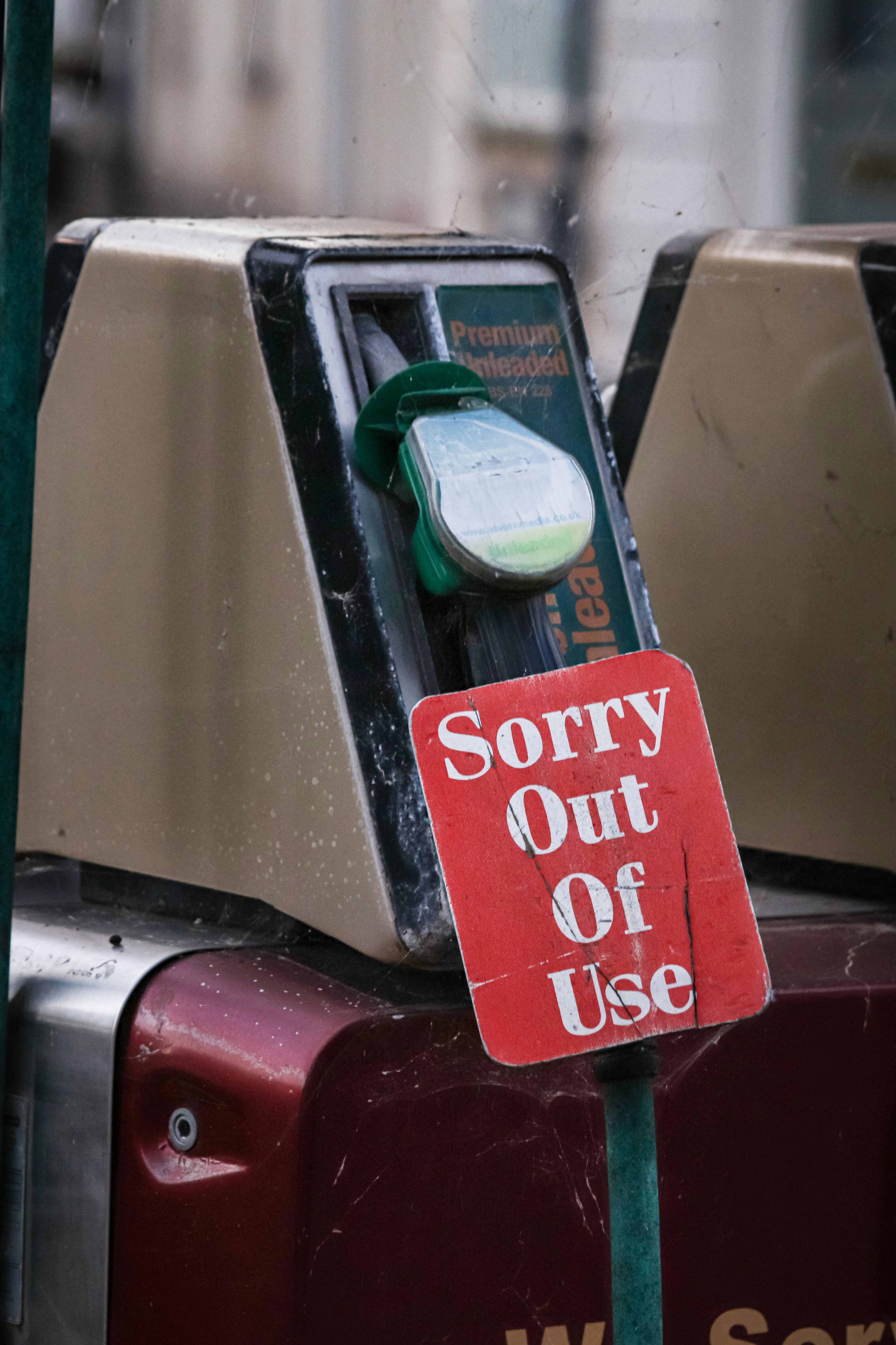 Red Signage on Fuel Pump · Free Stock Photo