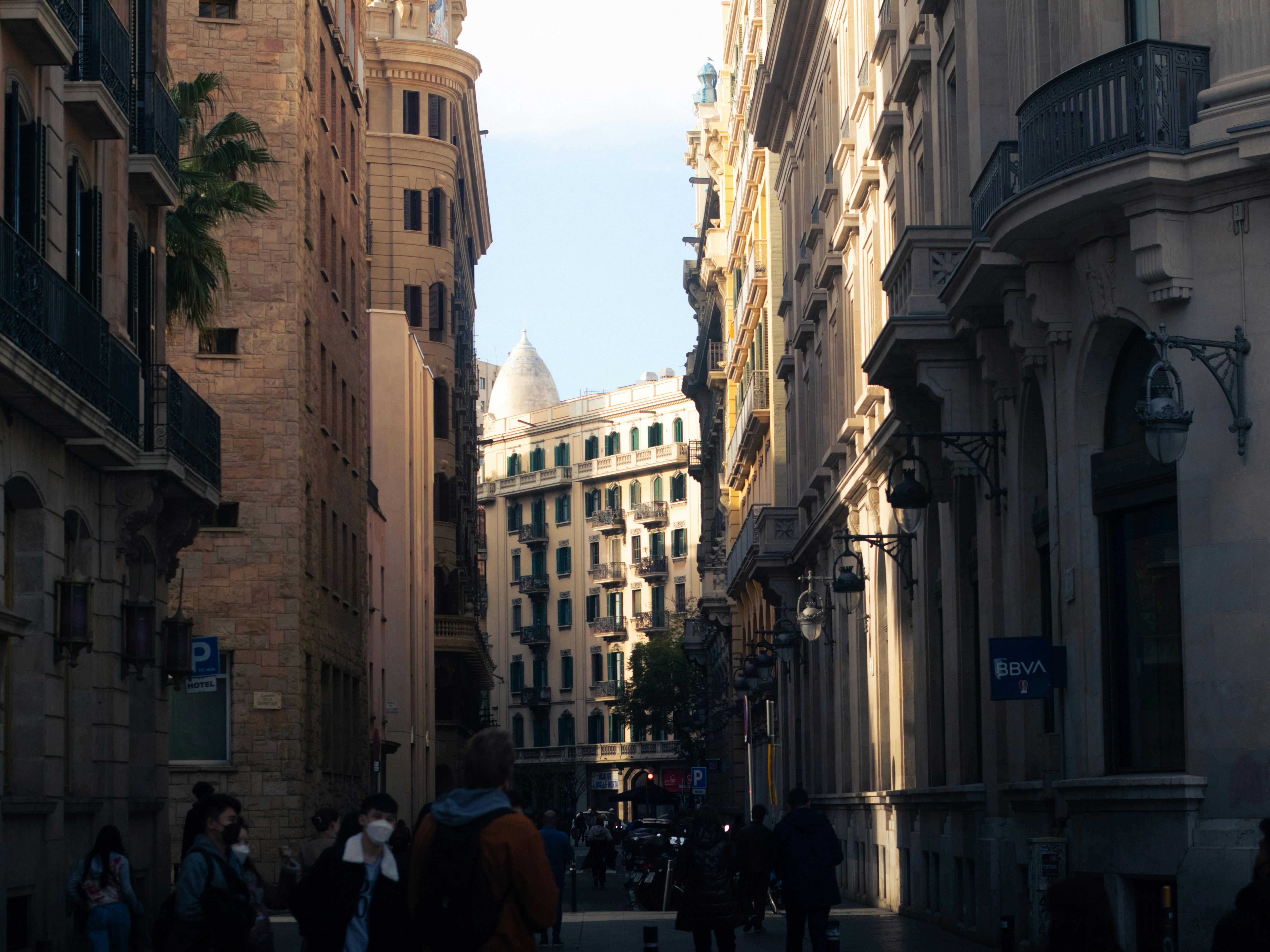 Tall Building Between Buildings · Free Stock Photo