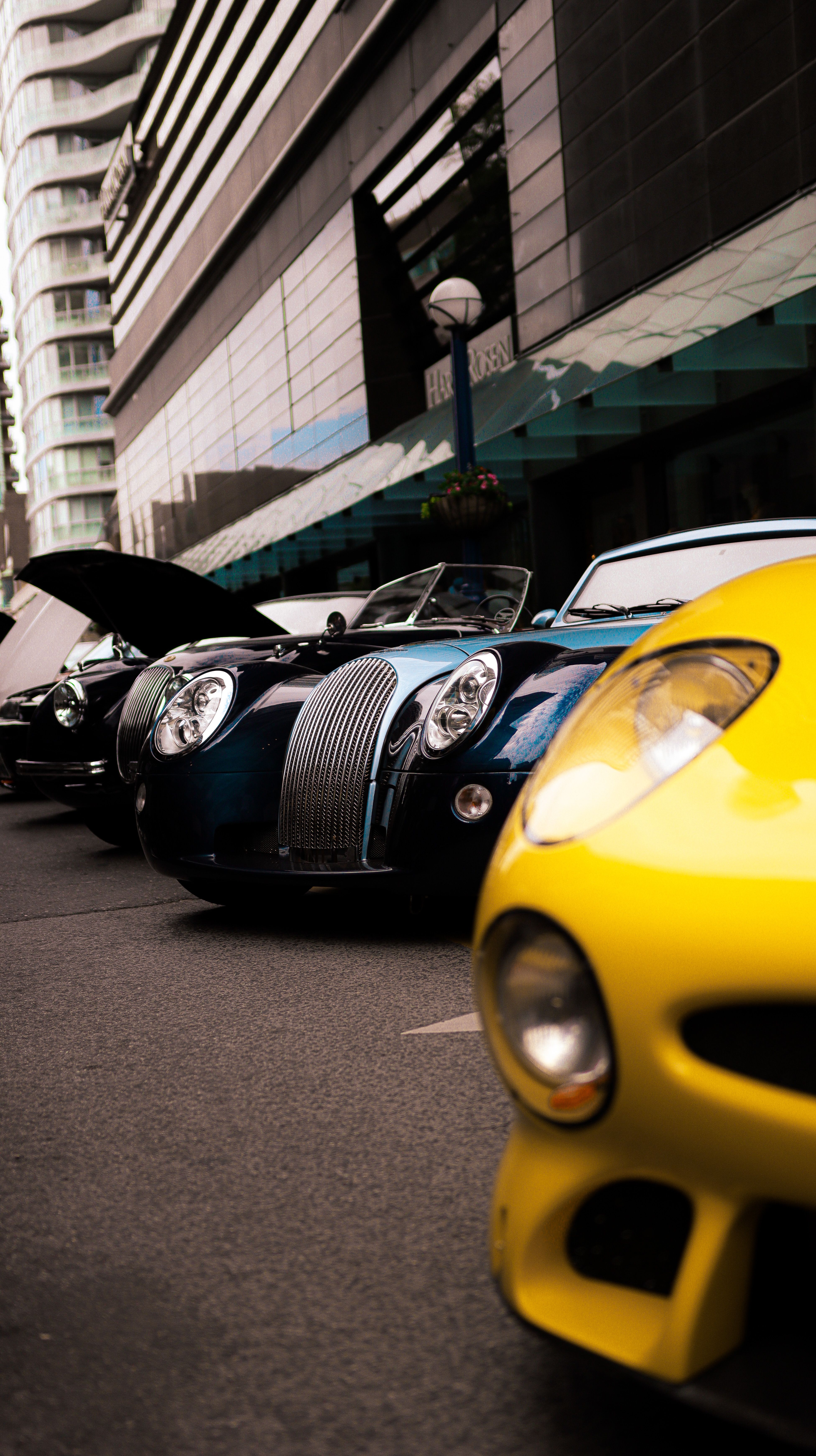 Expensive Cars Parked on the Side of the Road Near Building · Free ...